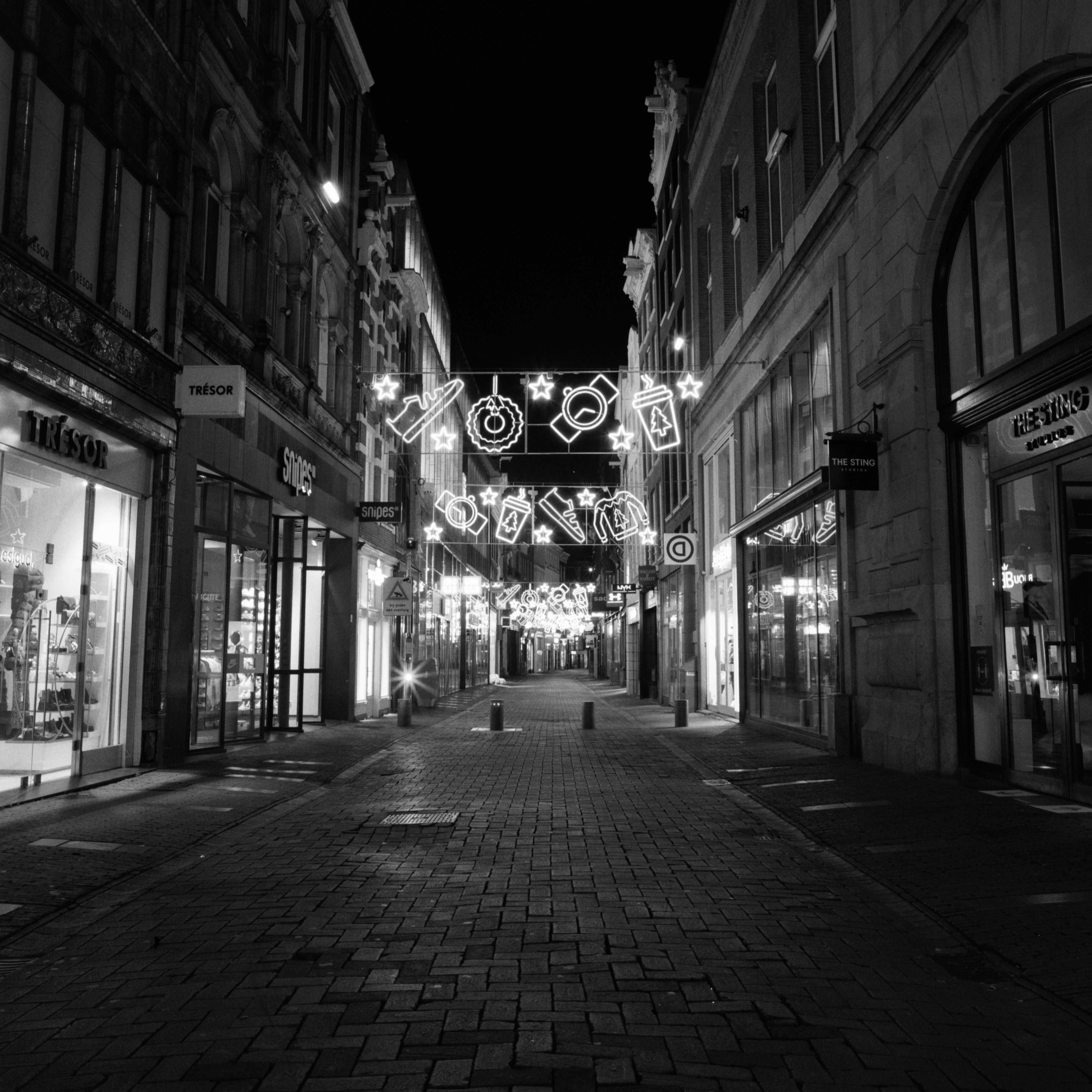 Grayscale photo of a street with lighted signage photo – Free Building ...