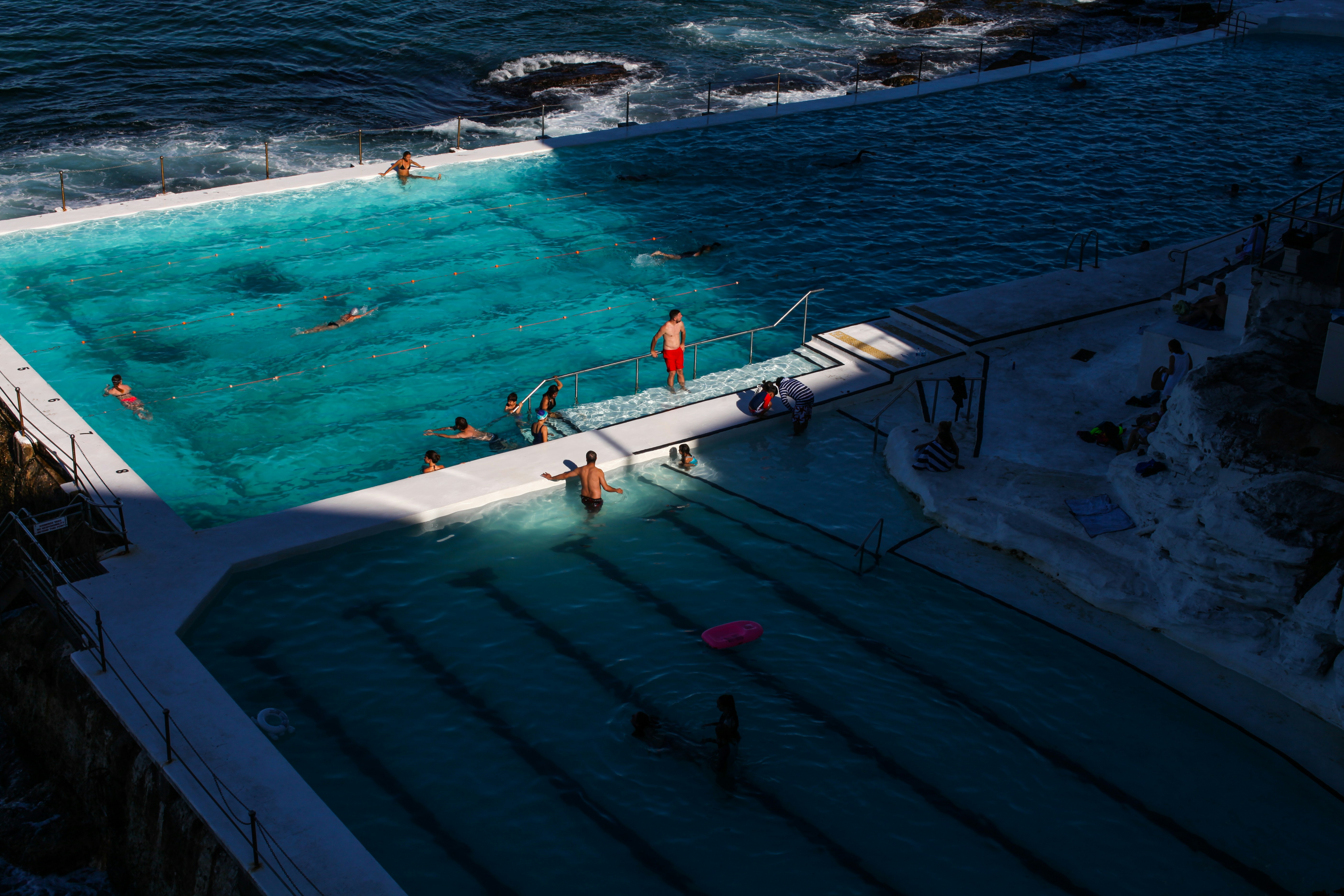 Cliffside Turquoise: Sunlit Swim at a Seaside Pool