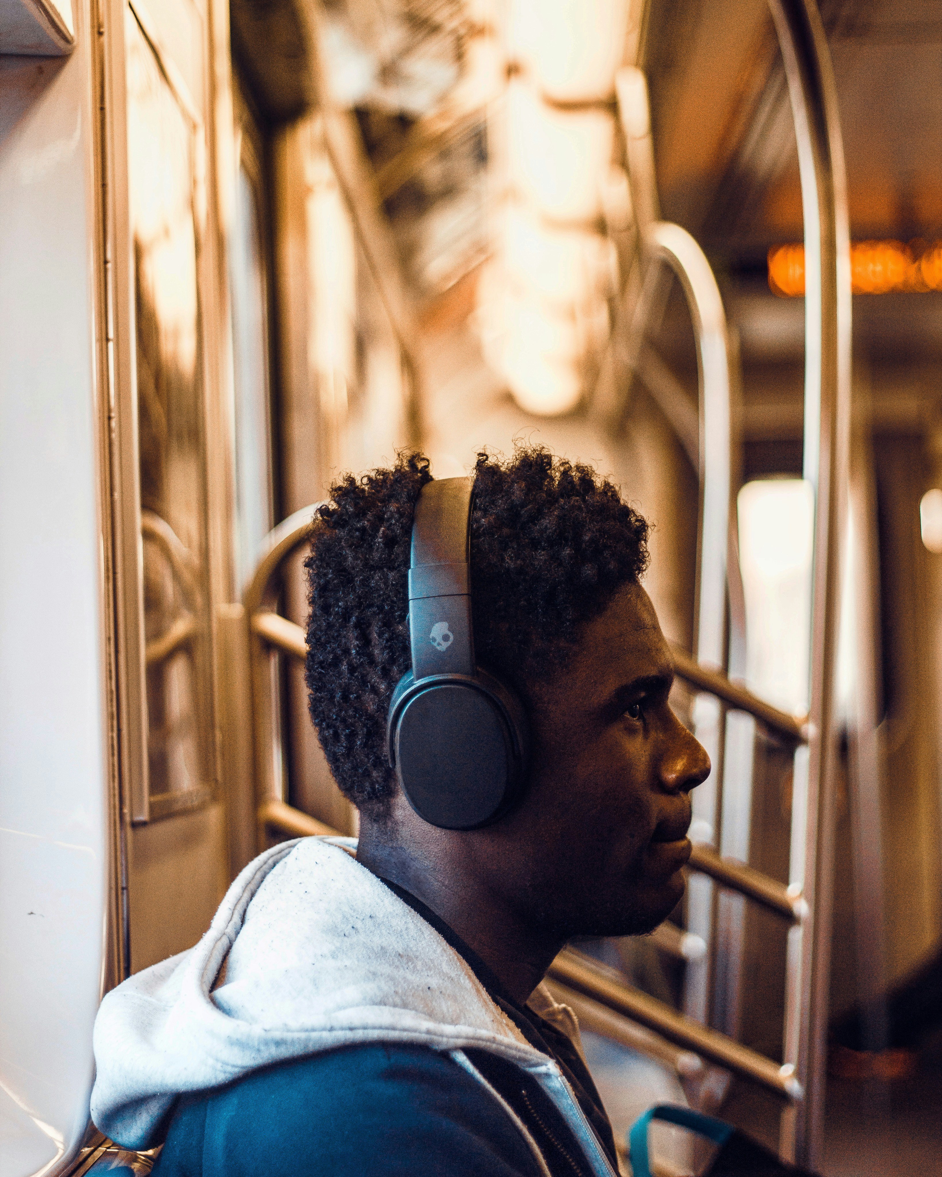 man in white shirt wearing black headphones
