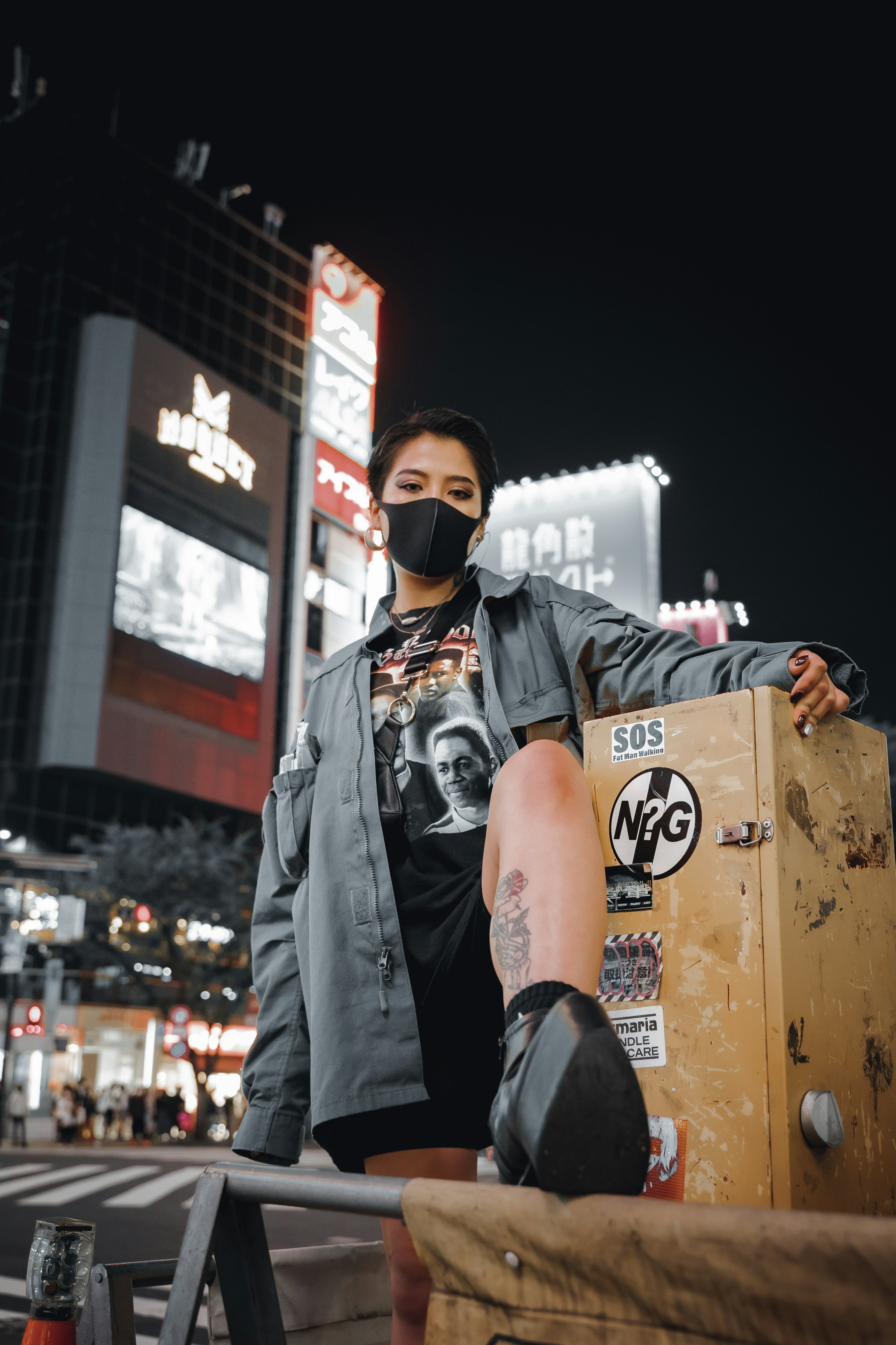 Neon Night Stance: A Masked Figure Anchored by a Weathered Cabinet