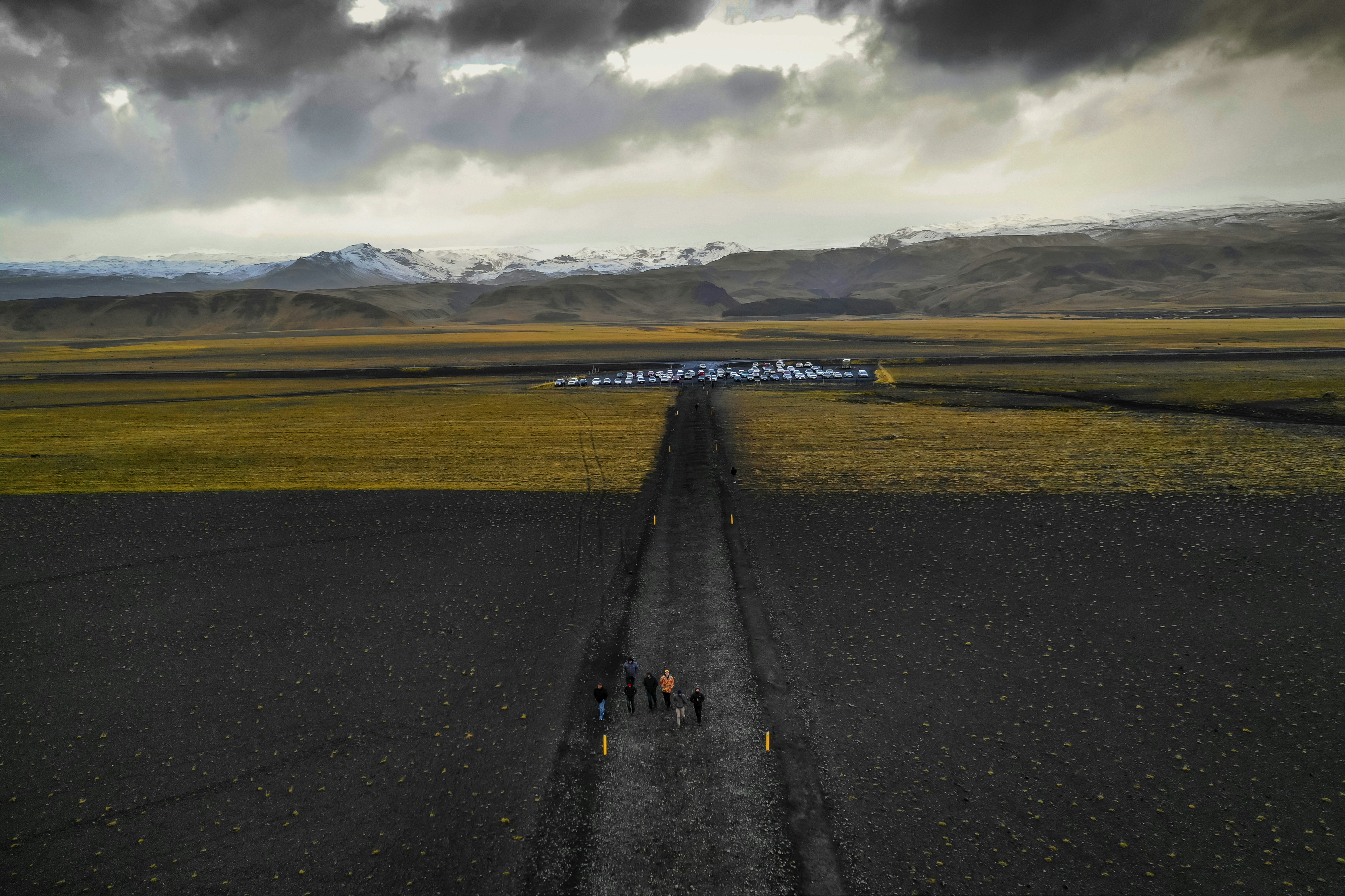 Line Through Lava: A Narrow Path to Distant White Tents