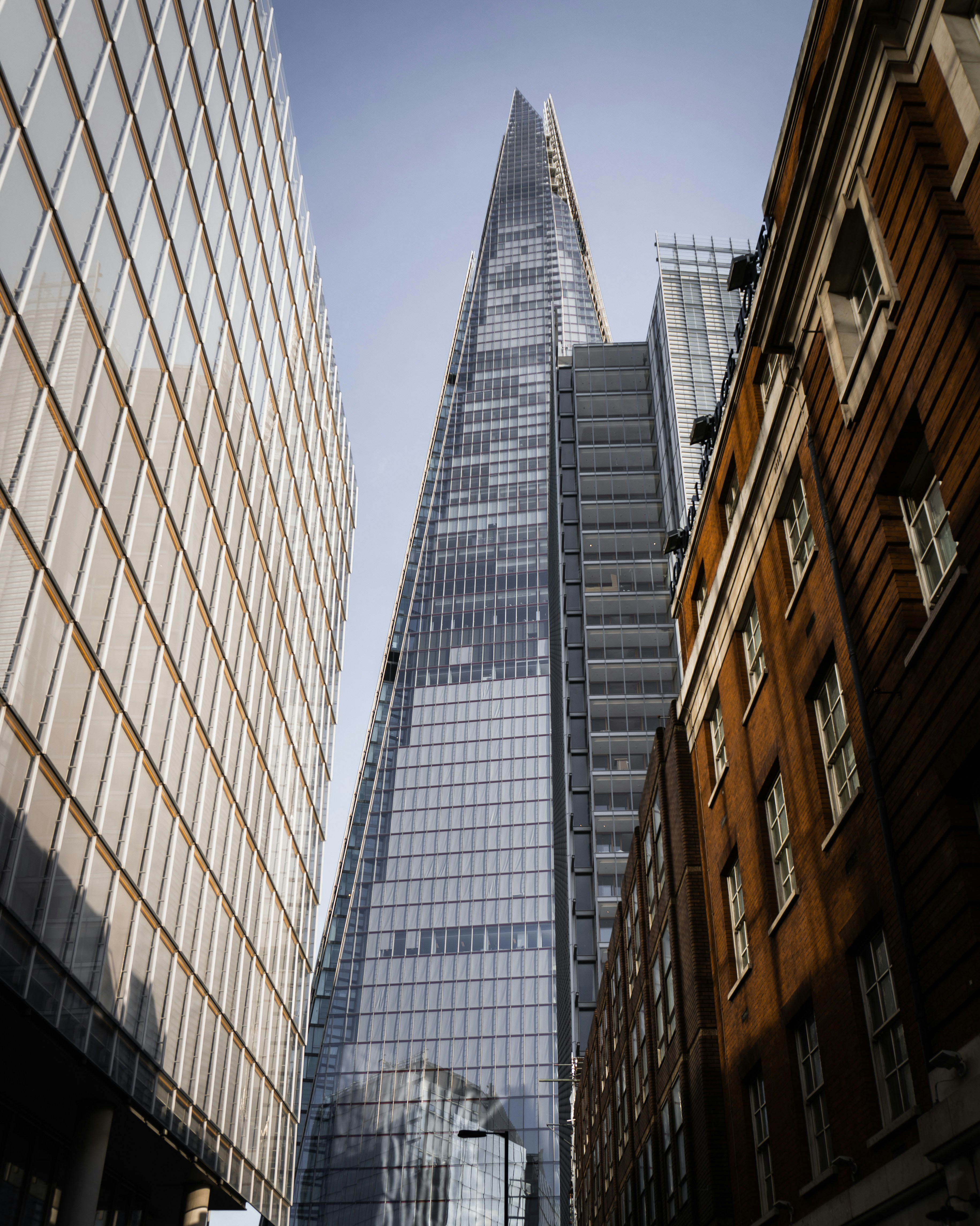 Pinnacle in the Gap: a Glass Tower Rising Between Brick Facades