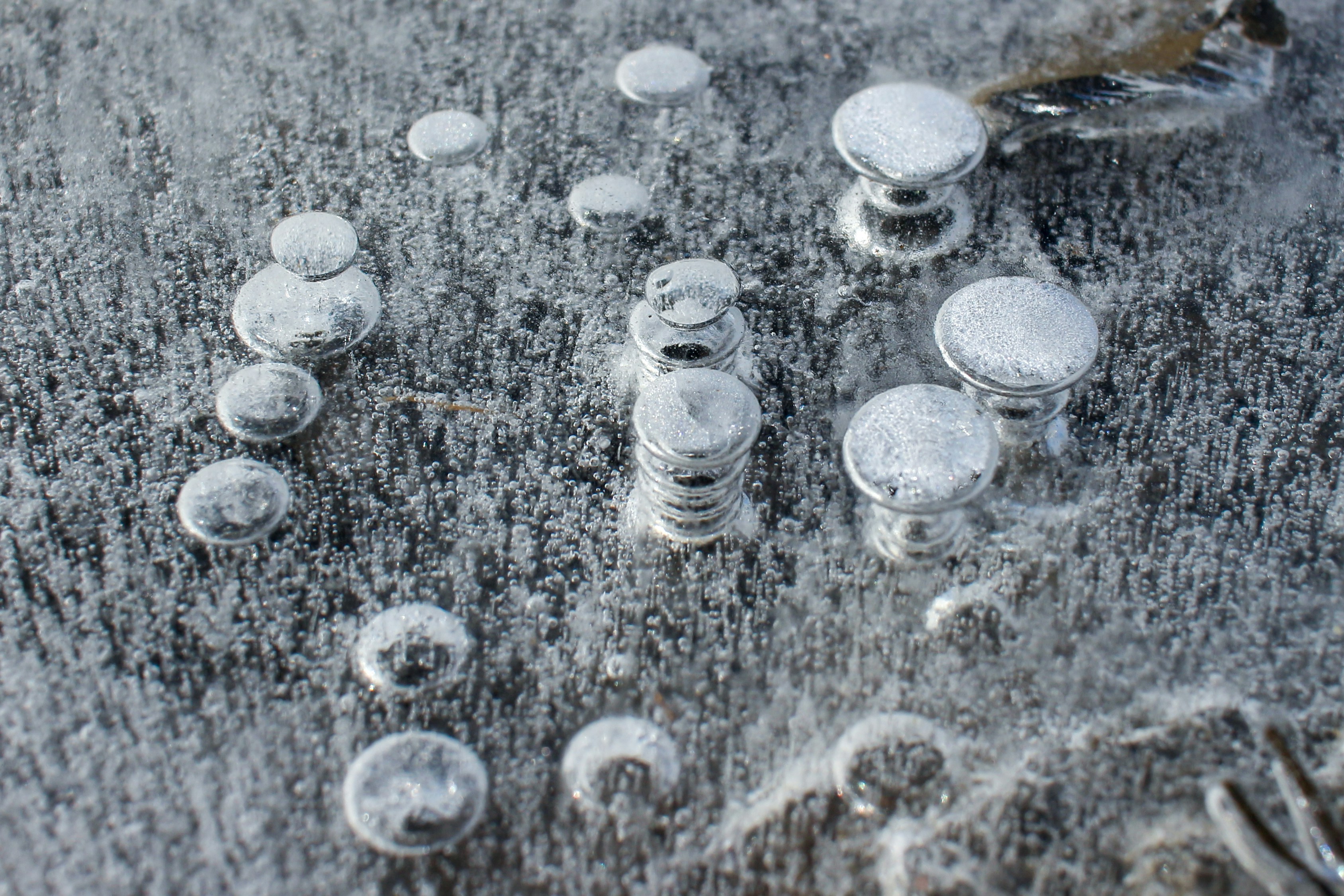 Beads of Frost on Weathered Concrete: A Macro Study