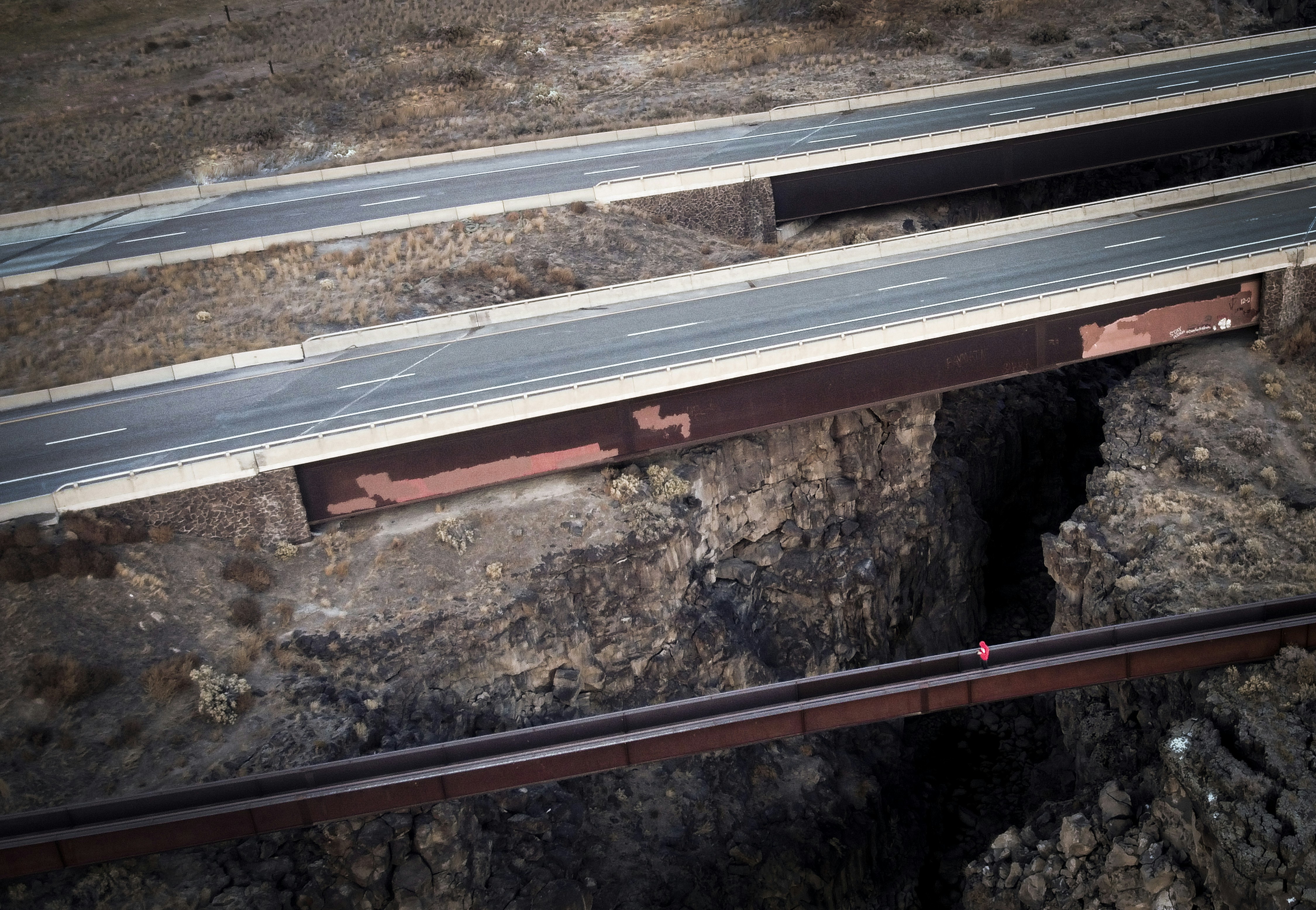 Edge of the Line: Rusted Rails Framing a Hidden Trench