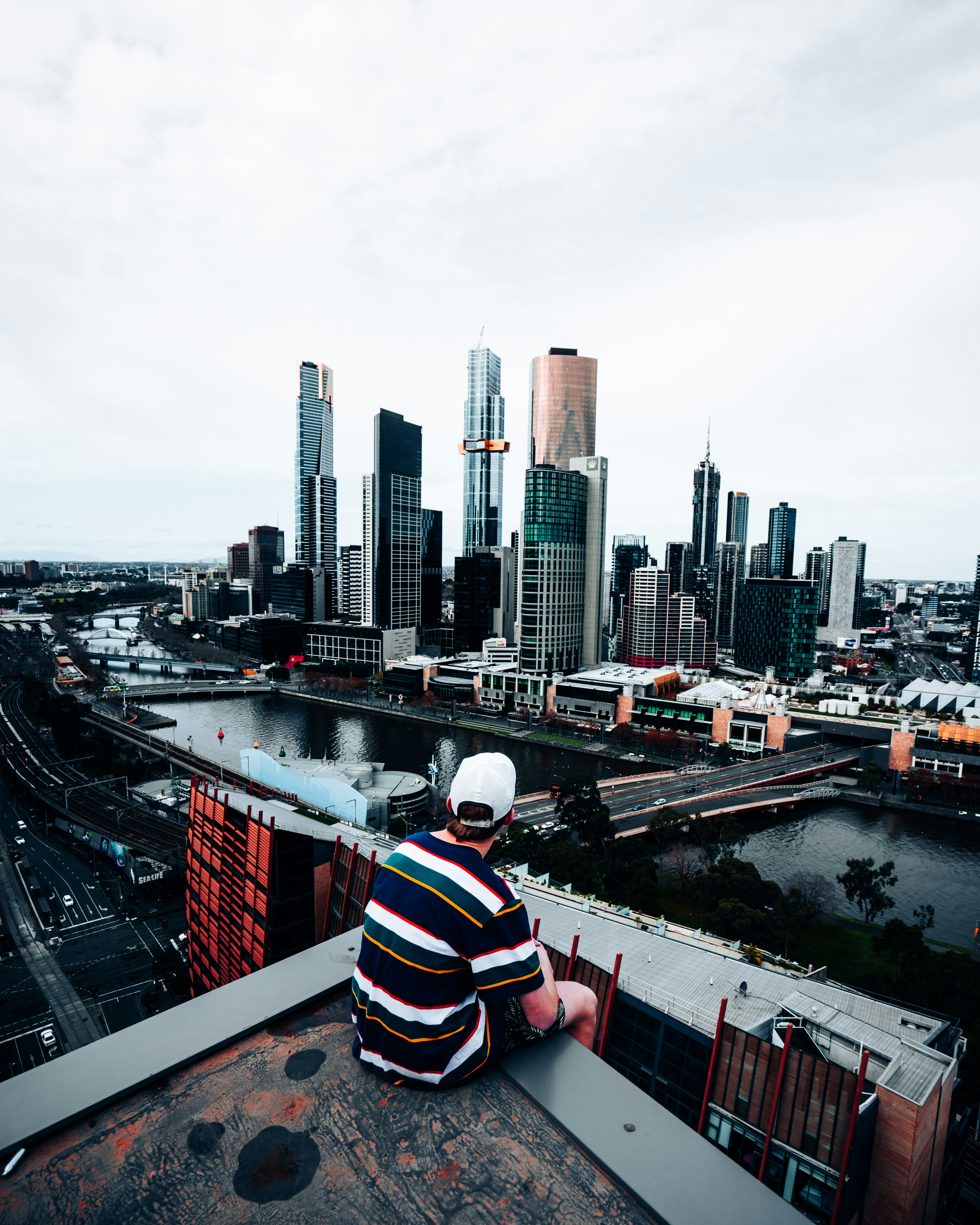 Rooftop Reverie: A Cityscape Encounter with a Seated Viewpoint