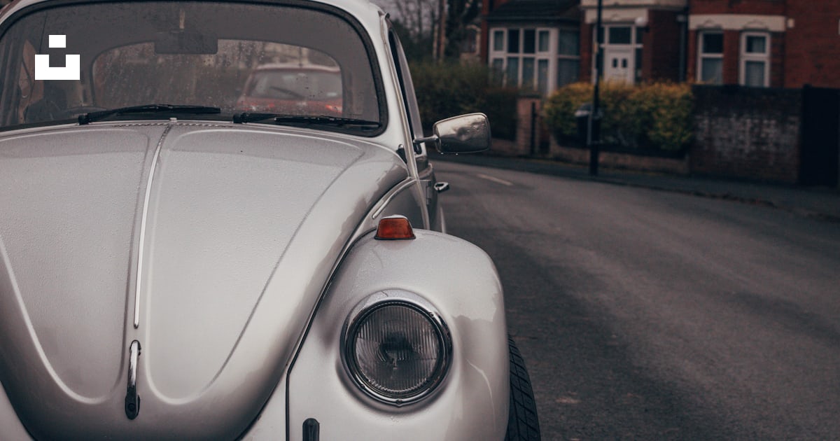 White Volkswagen Beetle Parked On Roadside During Daytime Photo Free