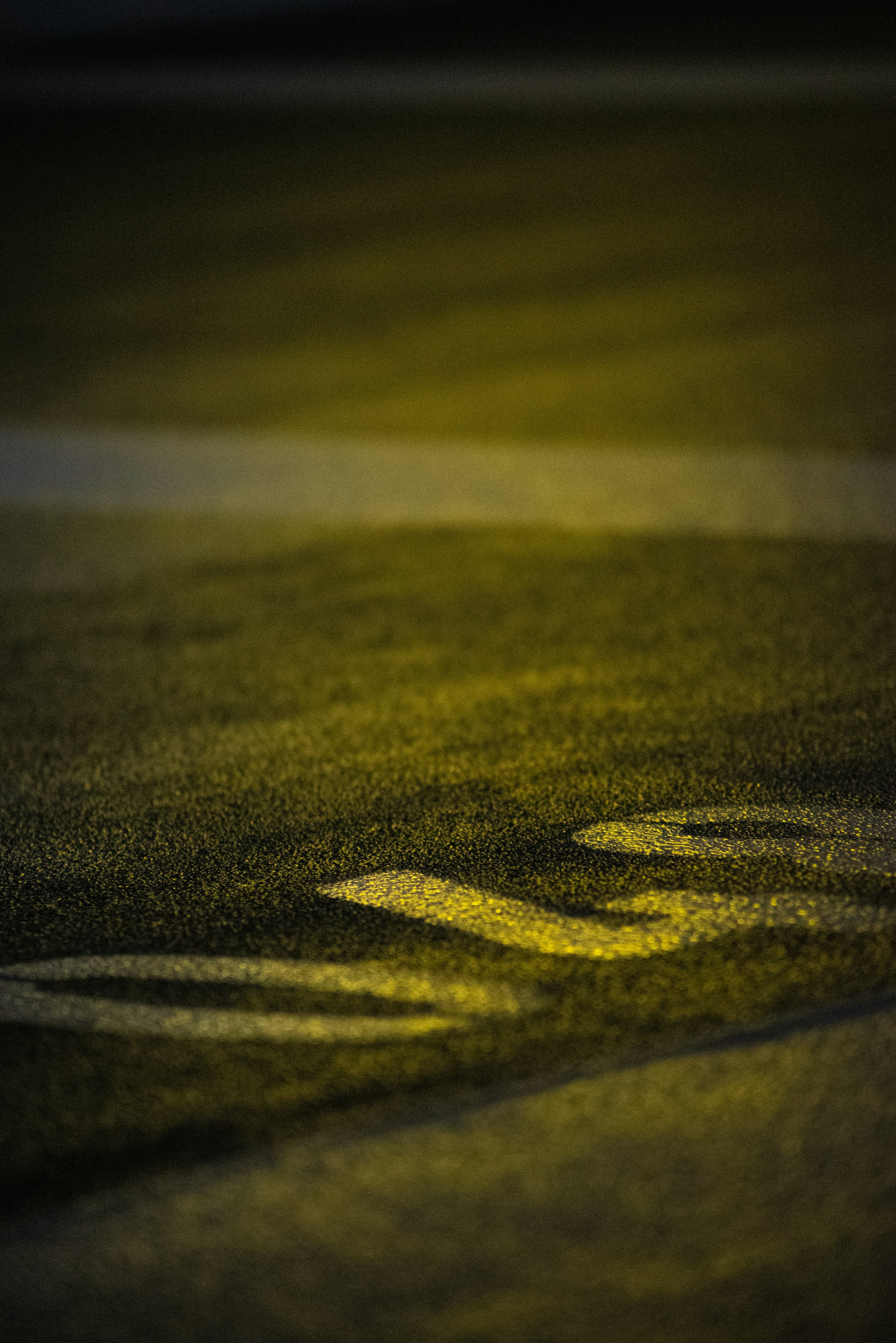 Amber Echoes on a Low-Light Road Mark