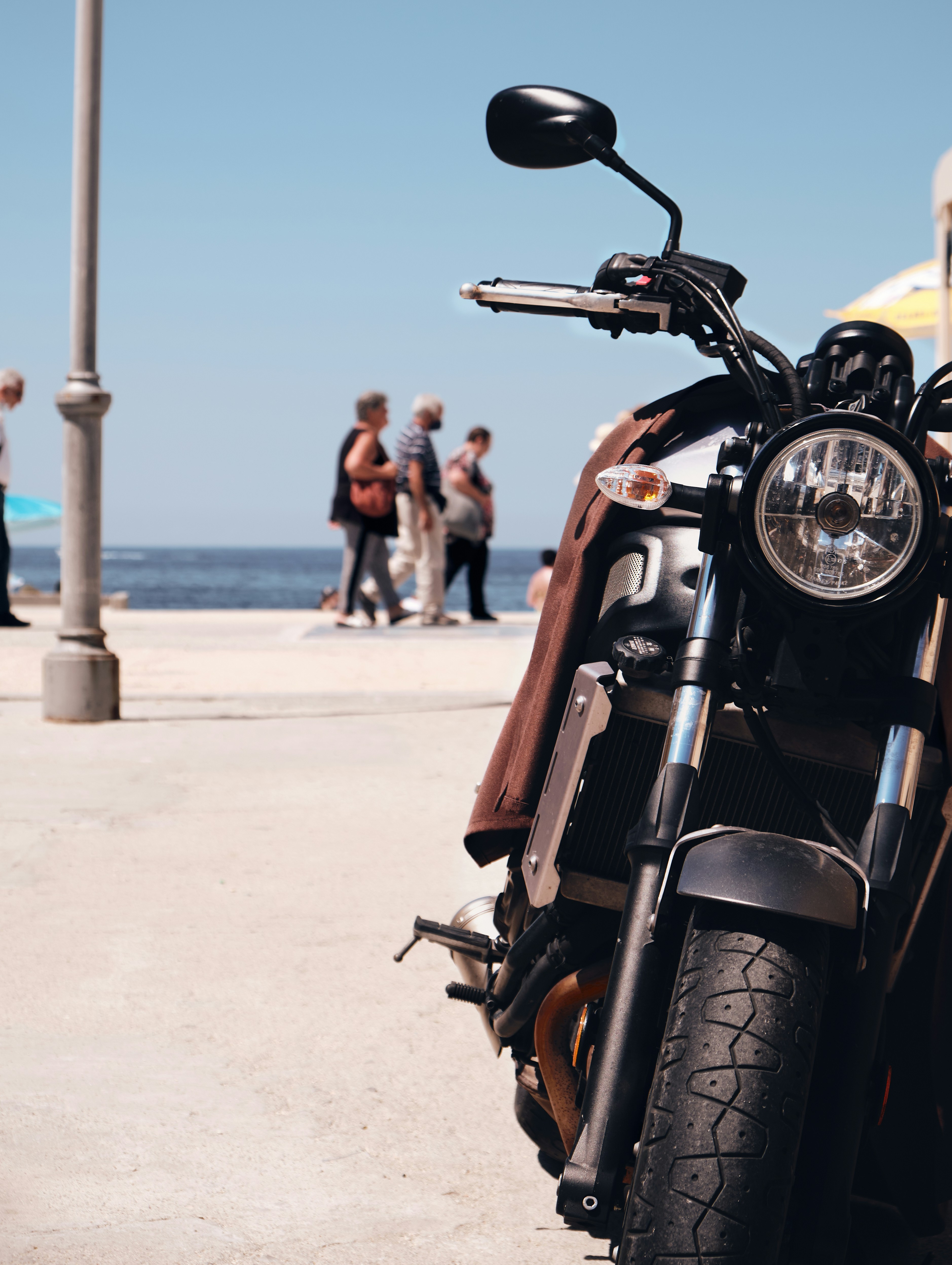 Front Wheel, Headlamp, and Riding Pose: Beachside Steel Silence