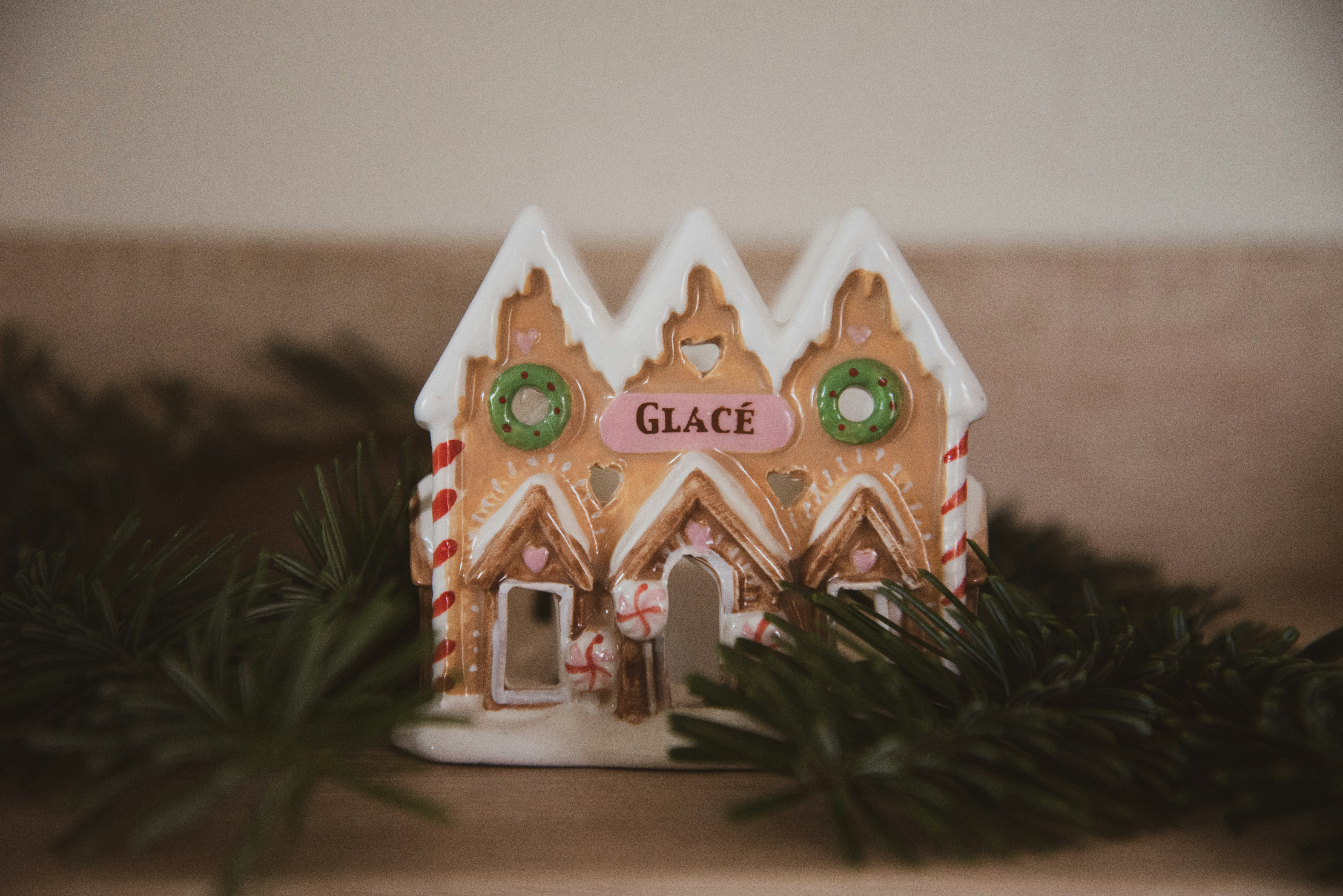 Glacé Gingerbread House Under a Soft Evergreen Glow