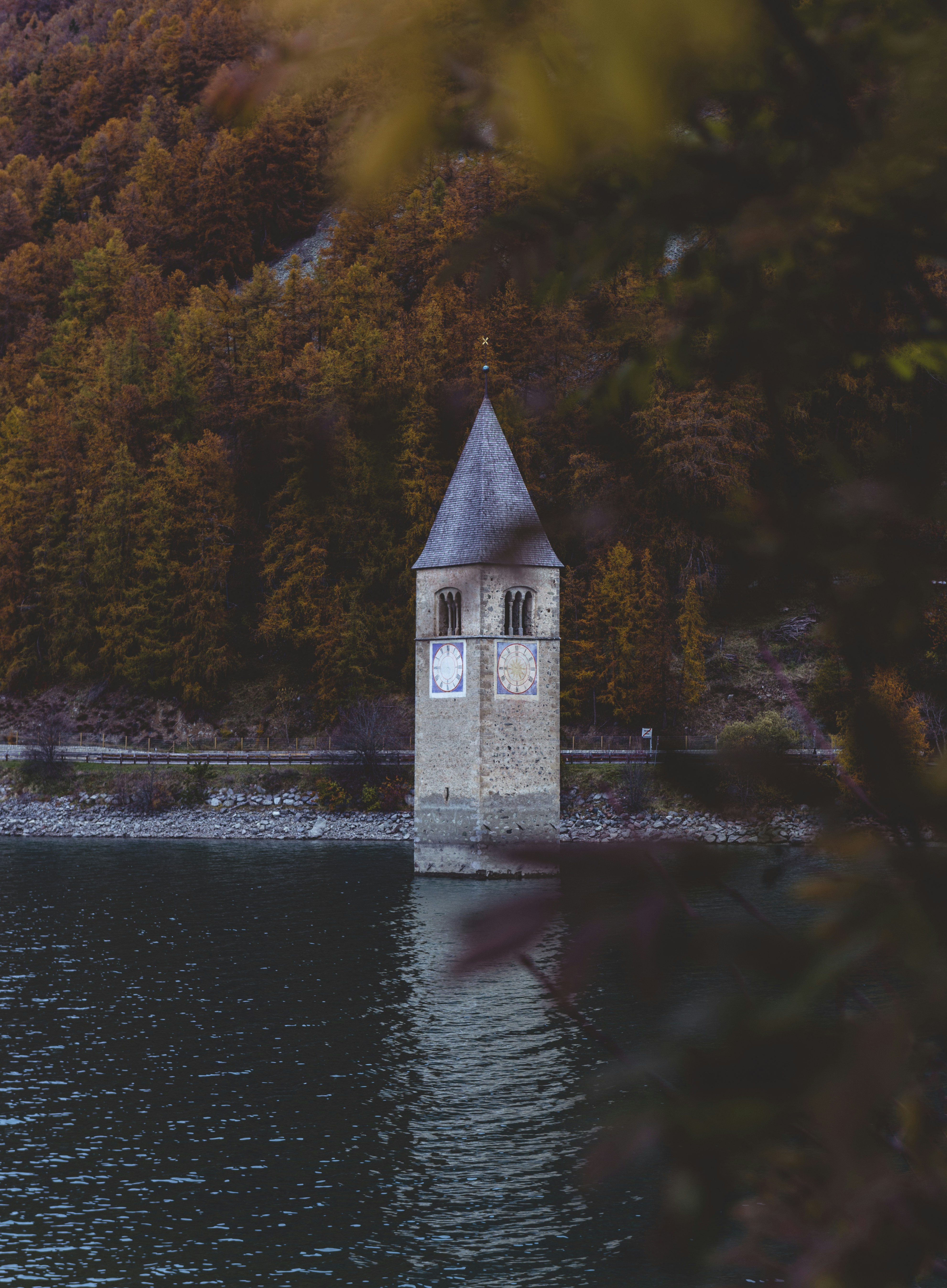 Timeless Bell Tower Rising from a Quiet Alpine Lake