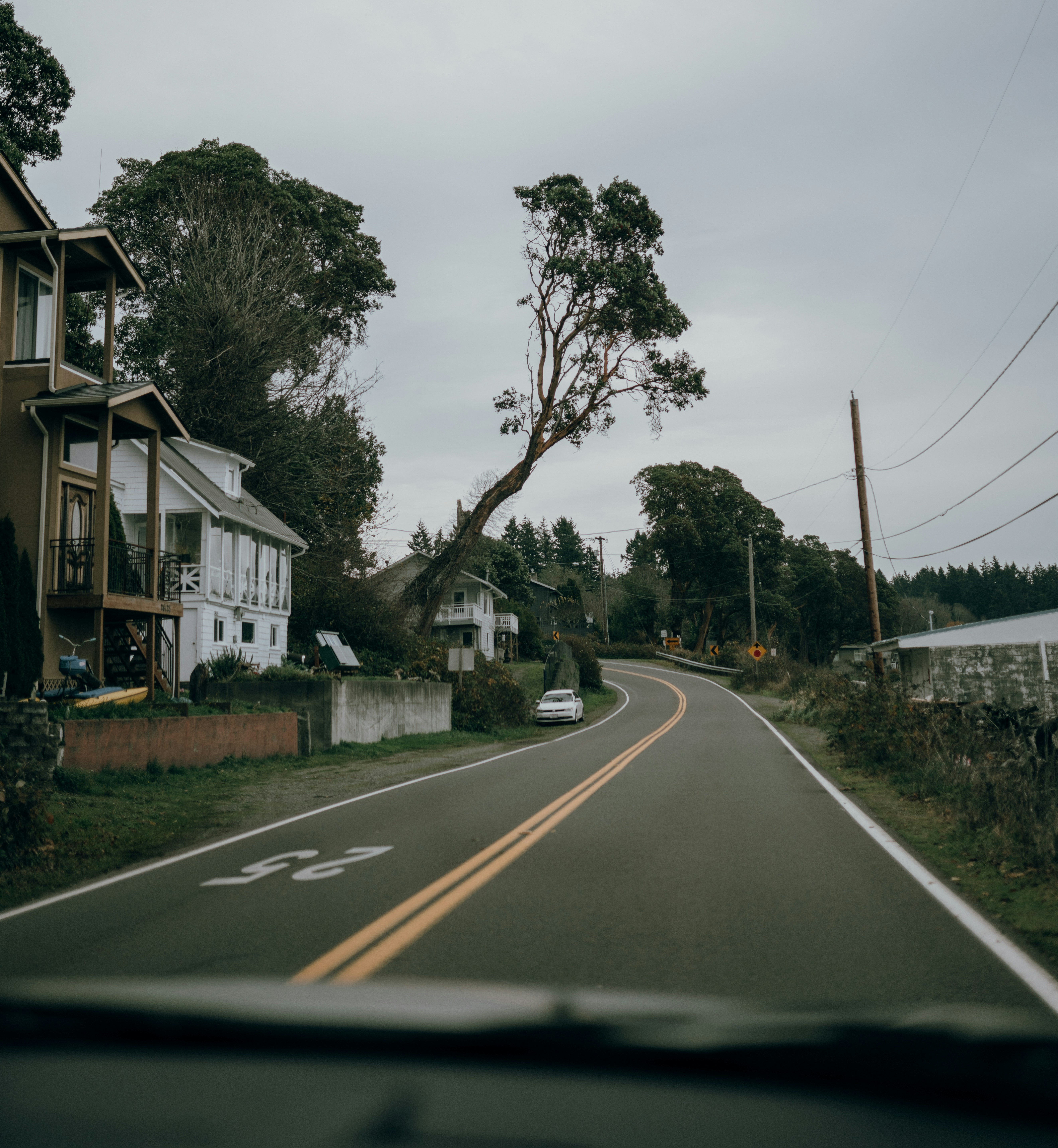 Gray concrete road between houses during daytime photo – Free Travel ...