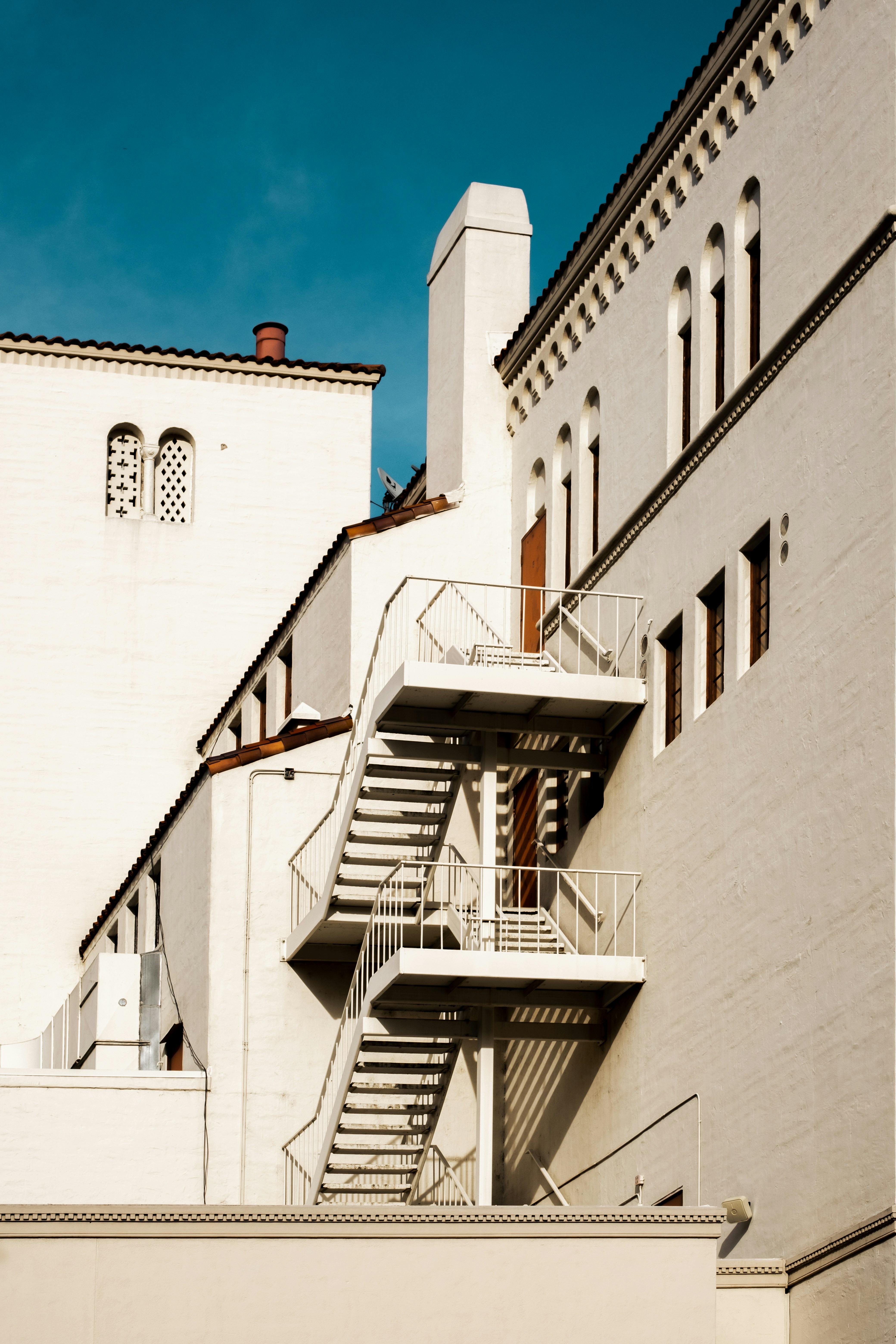 Photo of white building with staircase.