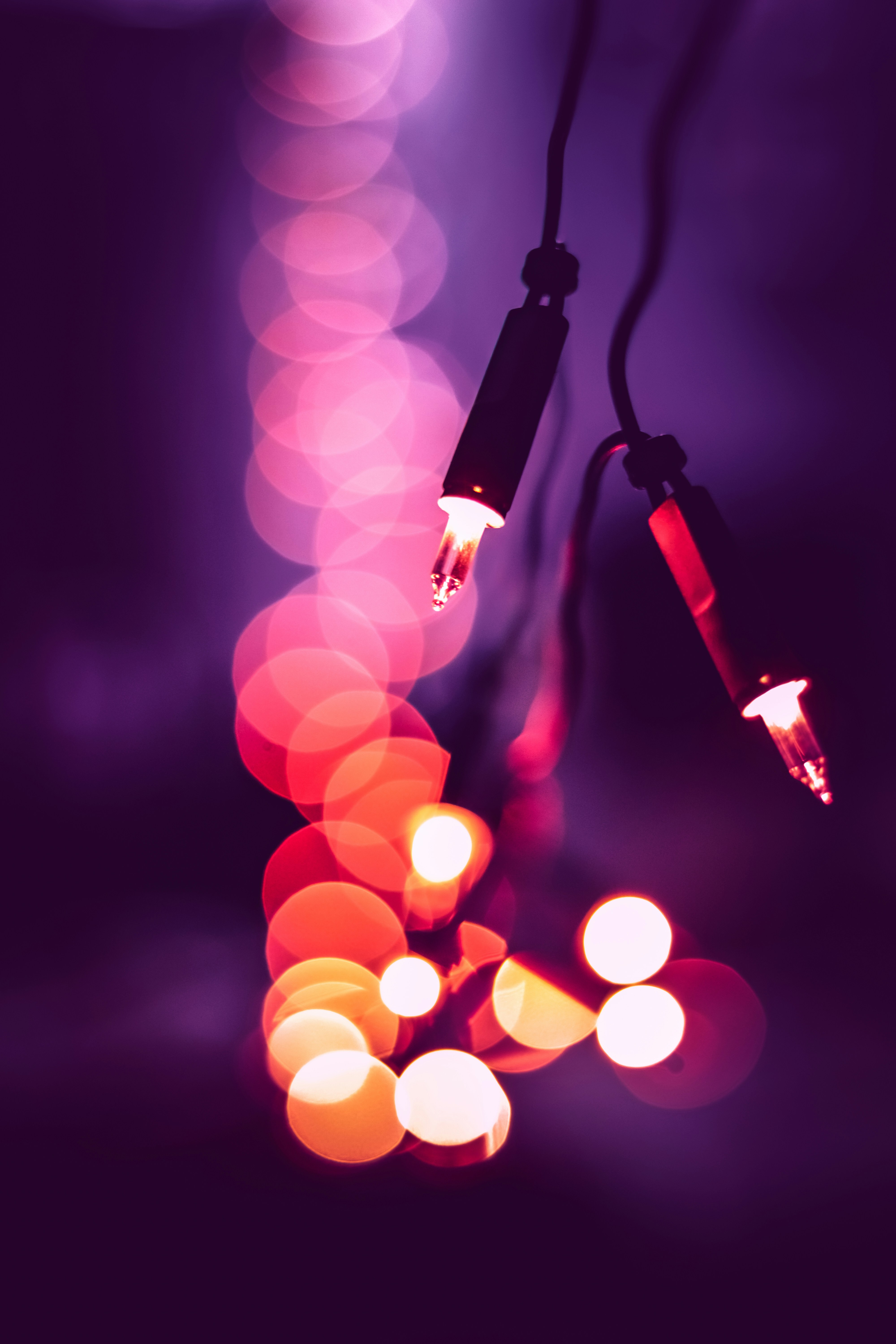 Violet Bokeh Cascade: Strings of Evening Lights