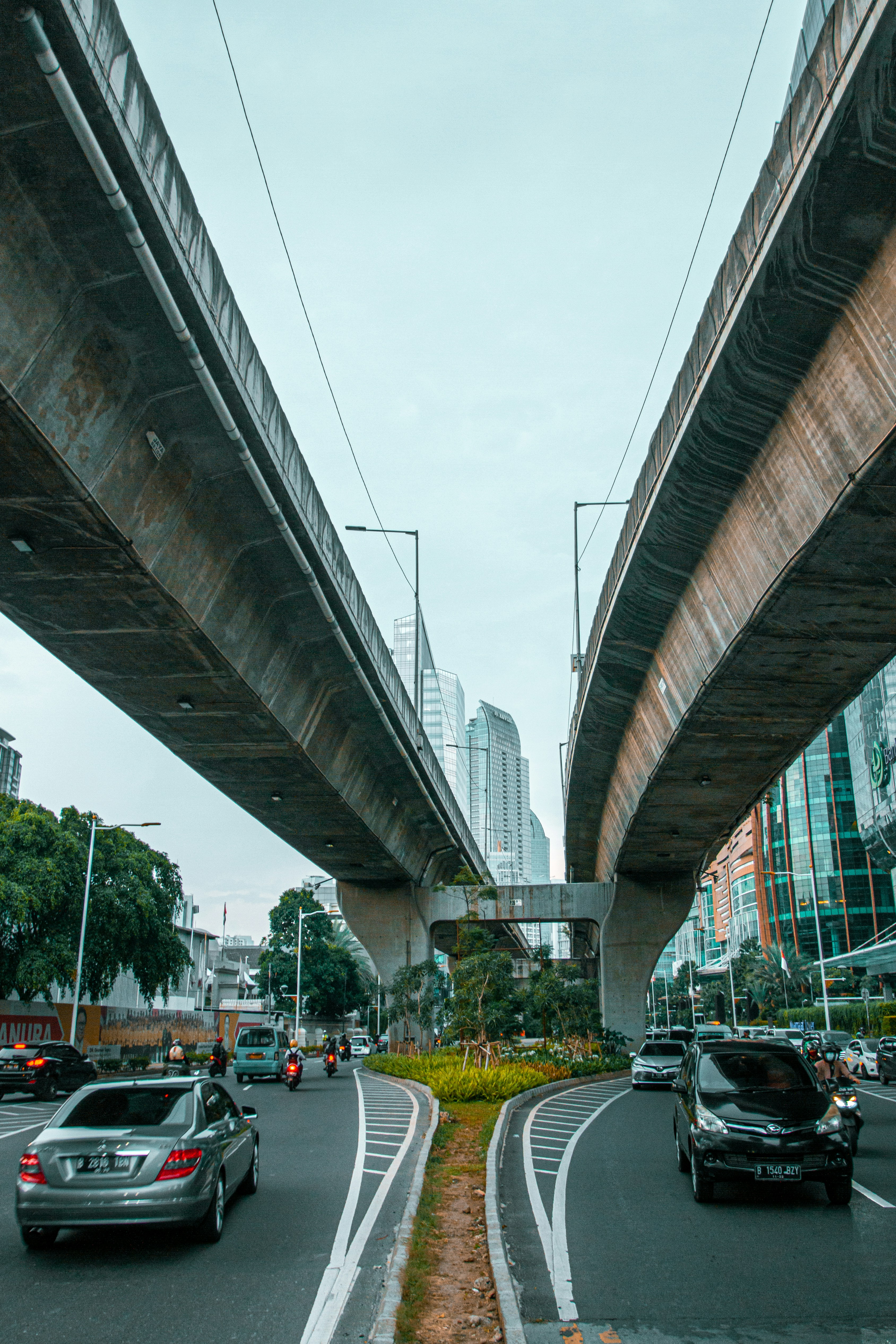 Cars on road under bridge during daytime photo – Free Indonesia Image ...