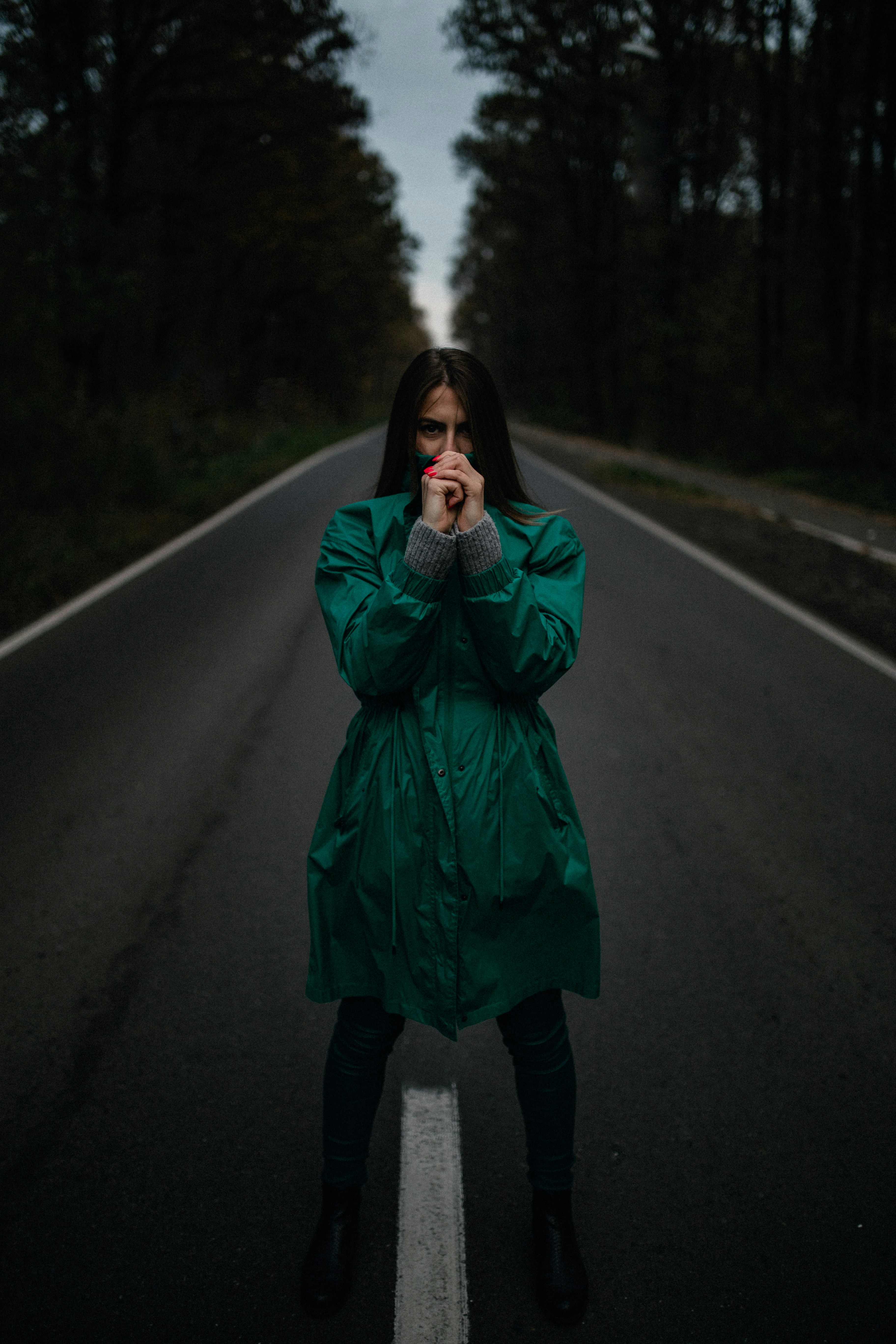 Midnight Road: Green Coat in a Quiet Street