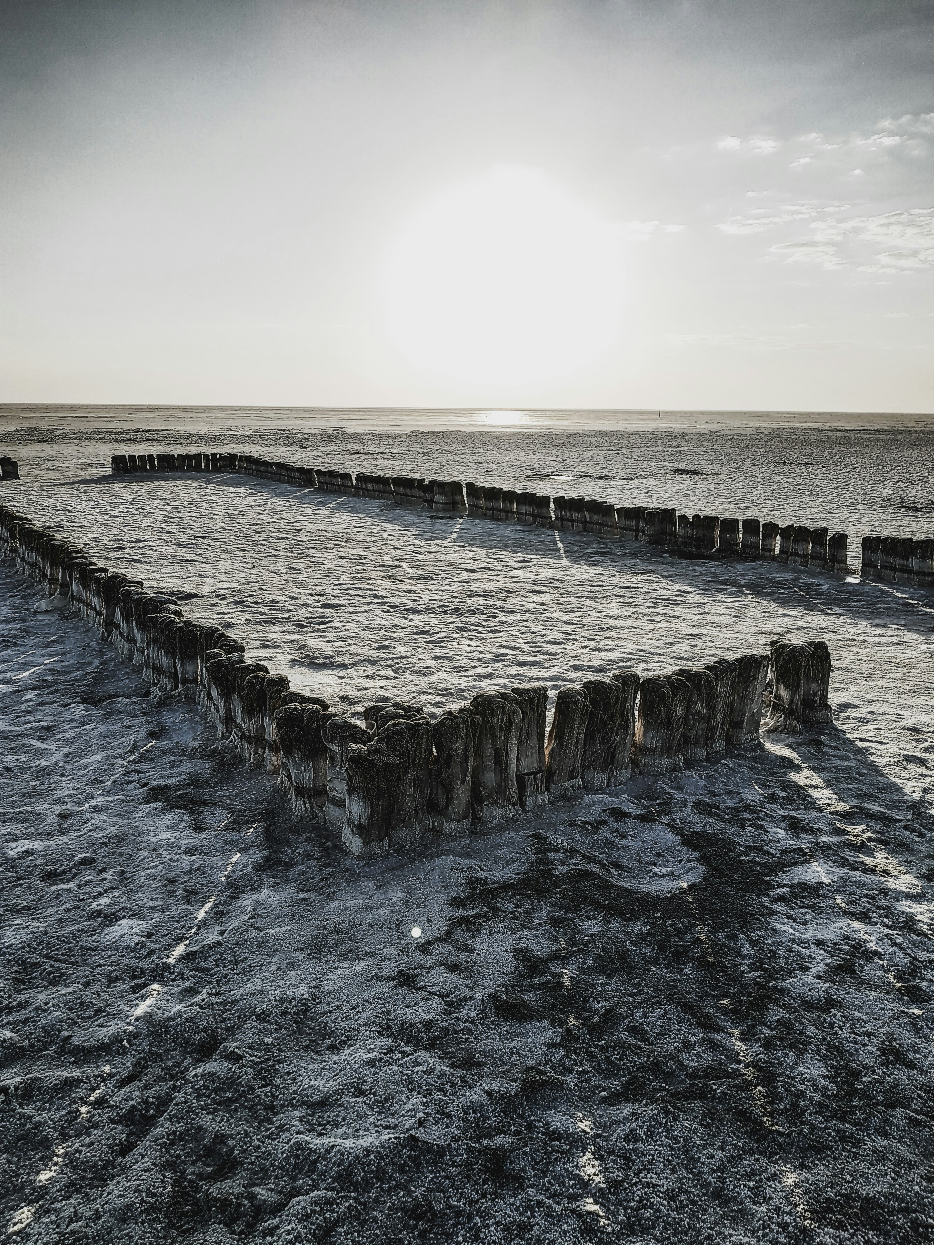 A concrete structure in the middle of the ocean photo – Free Salt lake ...