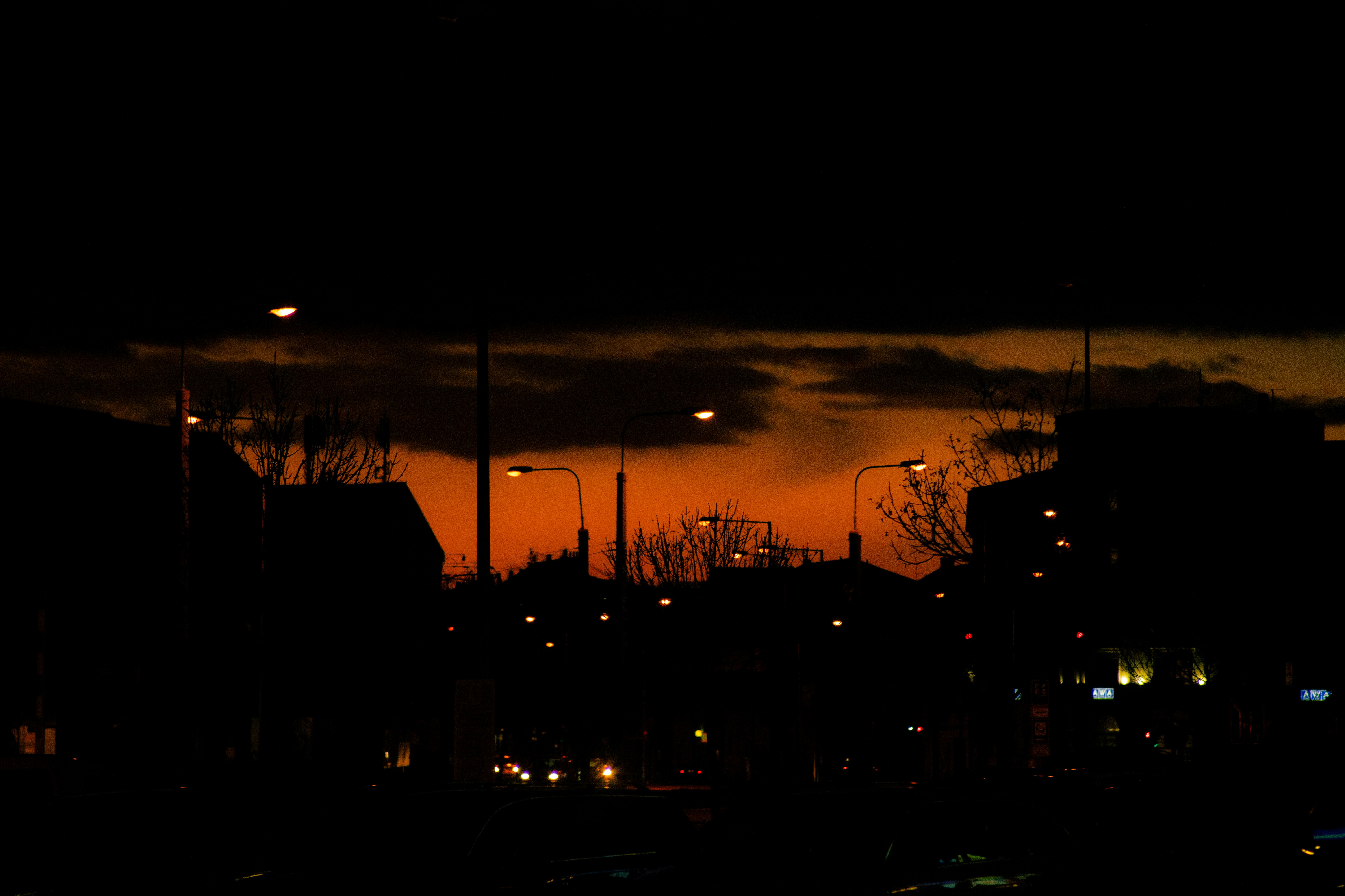 Ember Crown over a Quiet City: Dusk Silhouettes Against a Copper Horizon