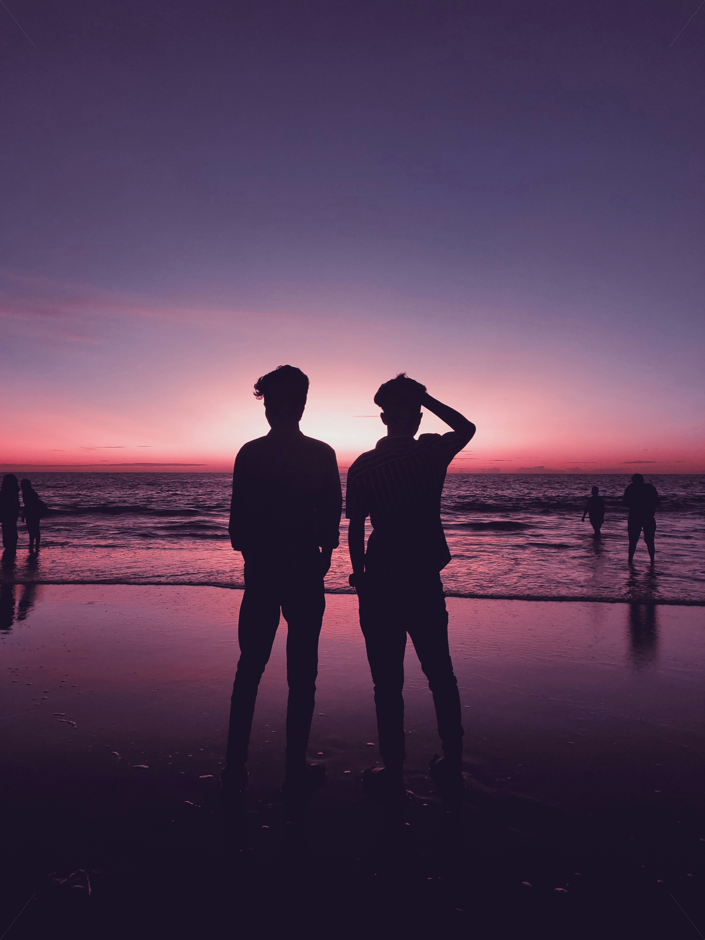 Two Friends Walking In The Sunset