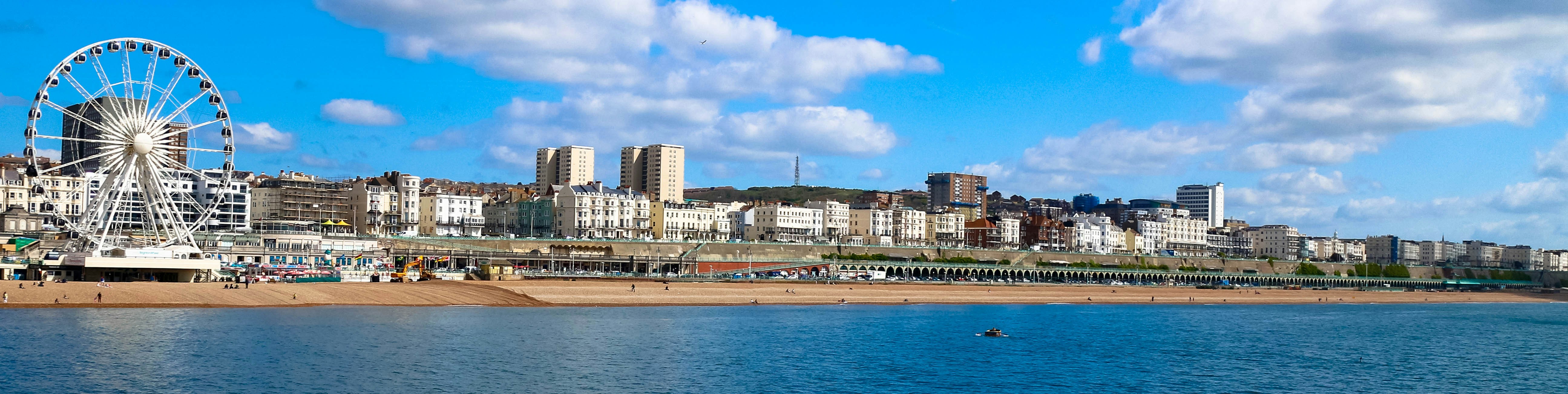 Seaside Ferris Wheel and Urban Horizon
