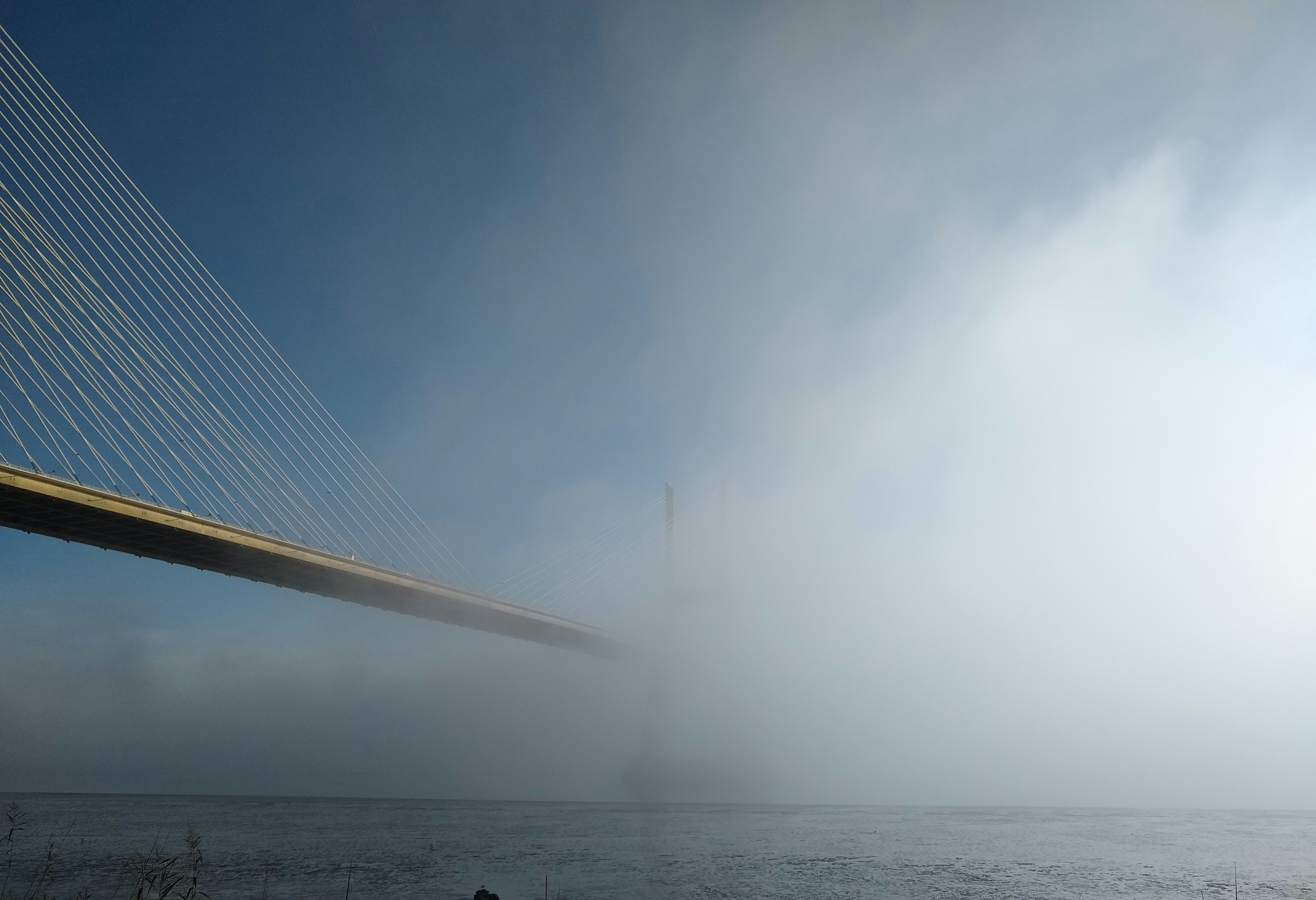 Brown bridge over body of water photo – Free Grey Image on Unsplash