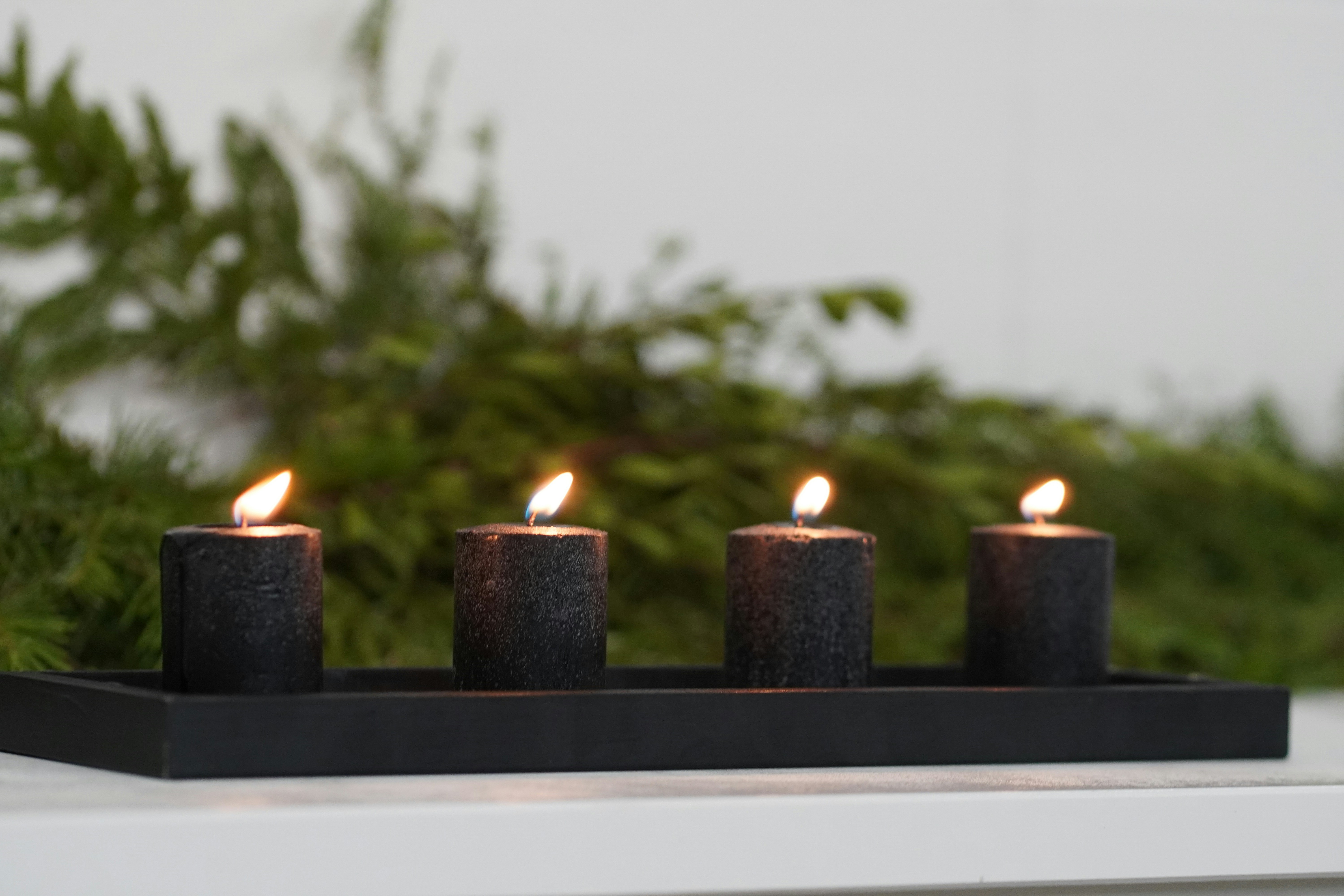 Four Candlelit Vignettes on a Minimal Mantel Tray