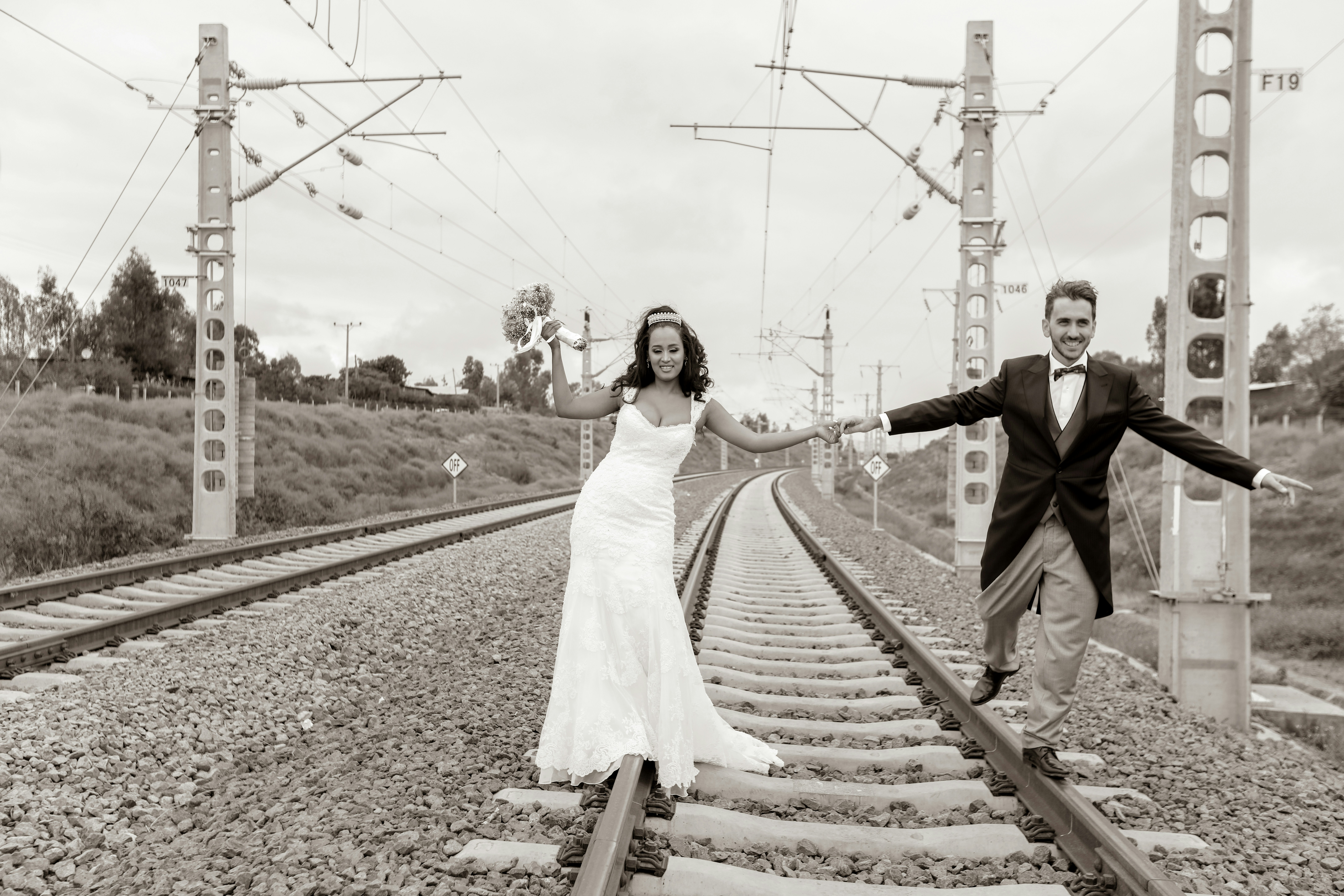 Two Step on Parallel Rails: A Bride and Groom Balance Between Tracks