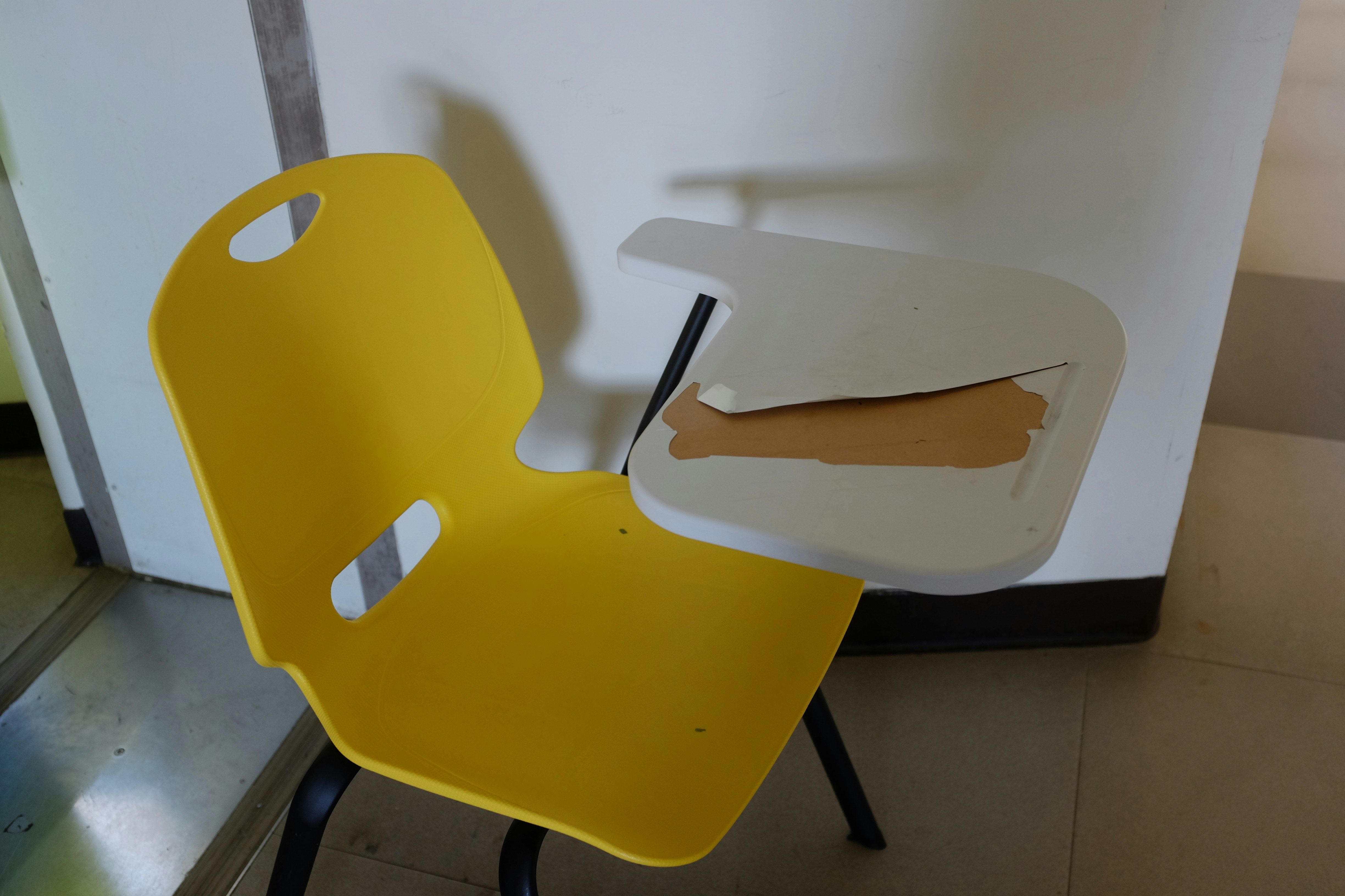 yellow and white plastic chair