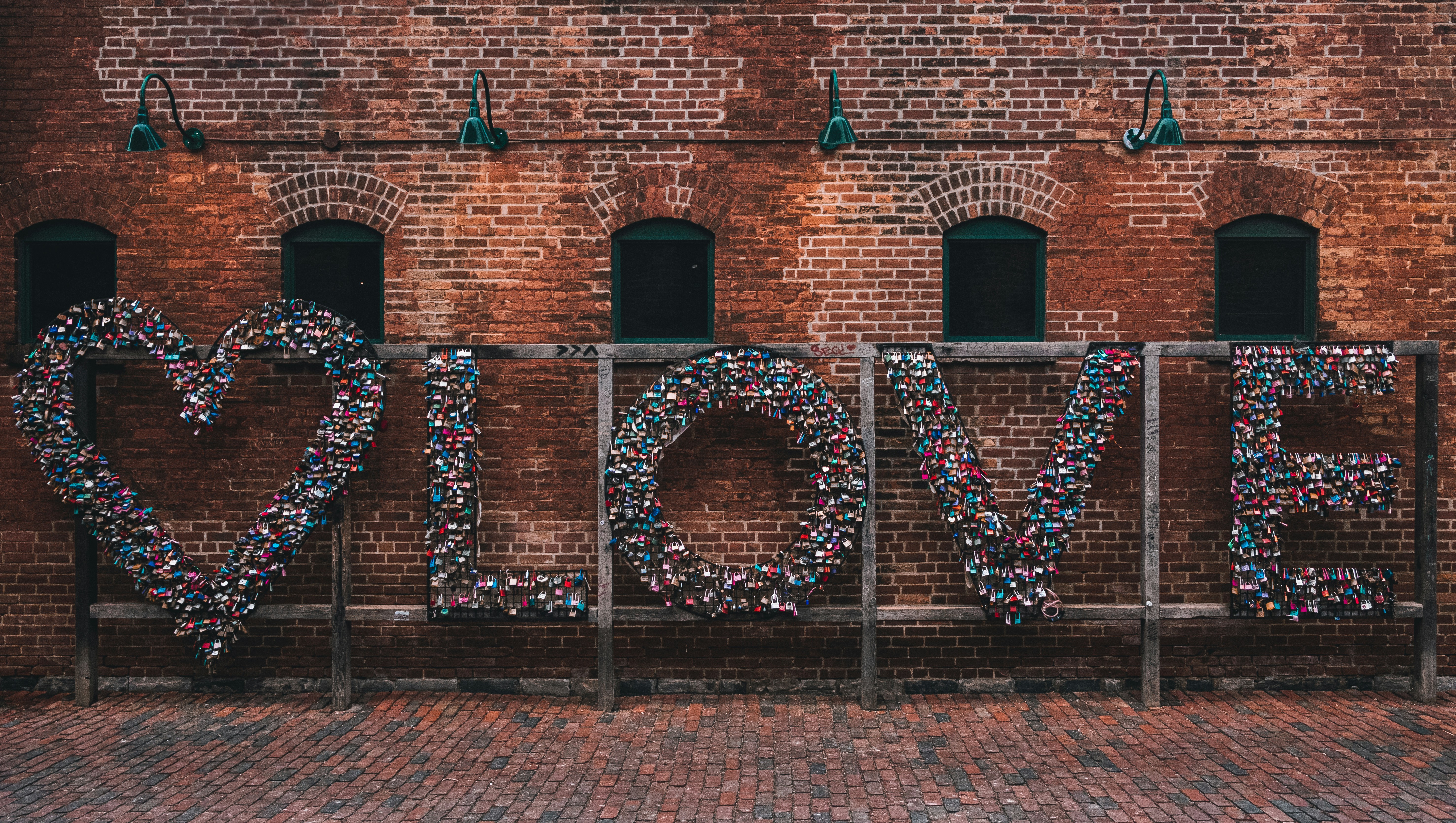 Brown brick wall with white and blue string lights photo – Free Art ...