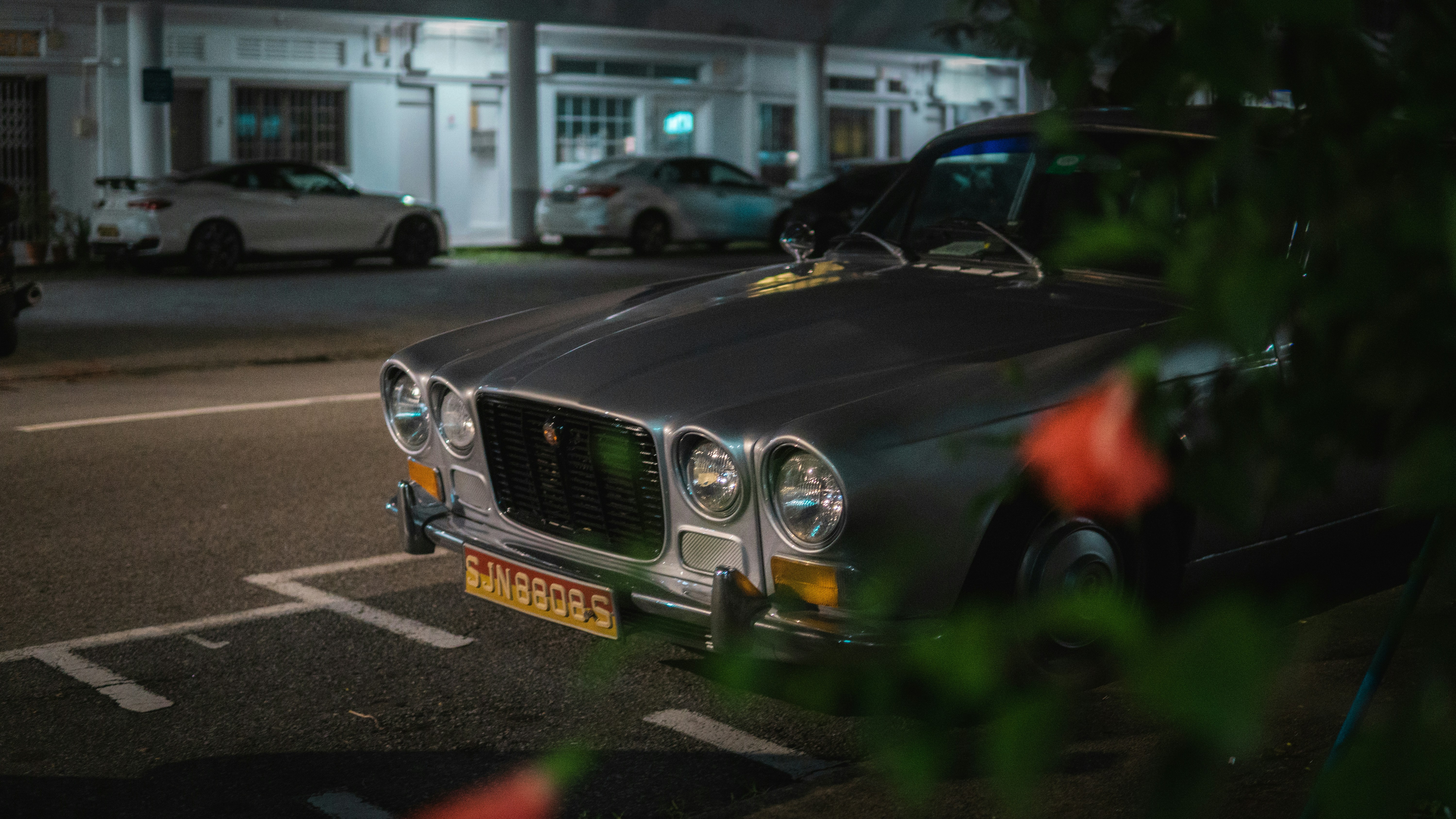 Midnight Chrome: Classic Car in a Quiet Street Glow