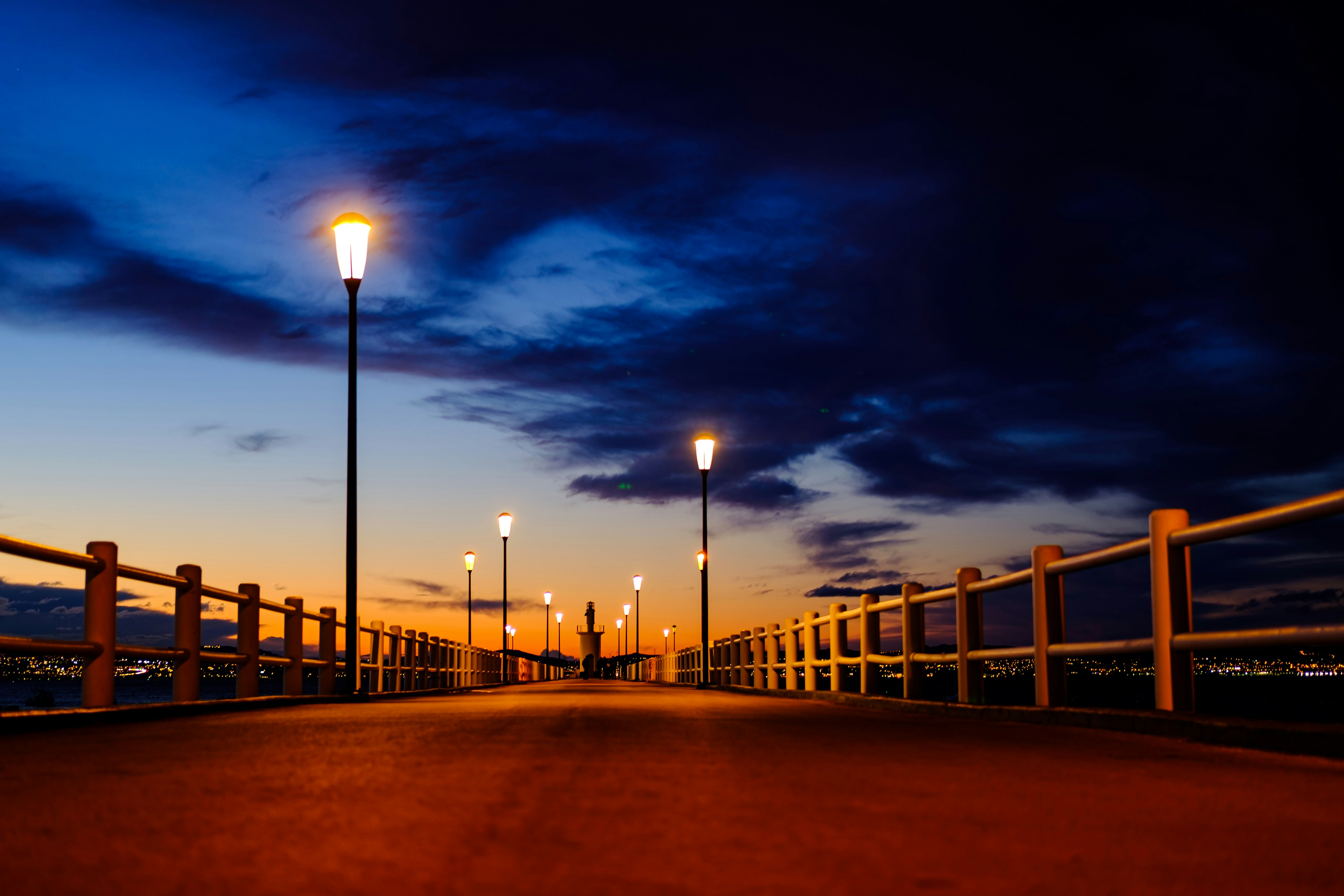 Lighted post lamps on bridge during night time photo – Free Lisbon ...