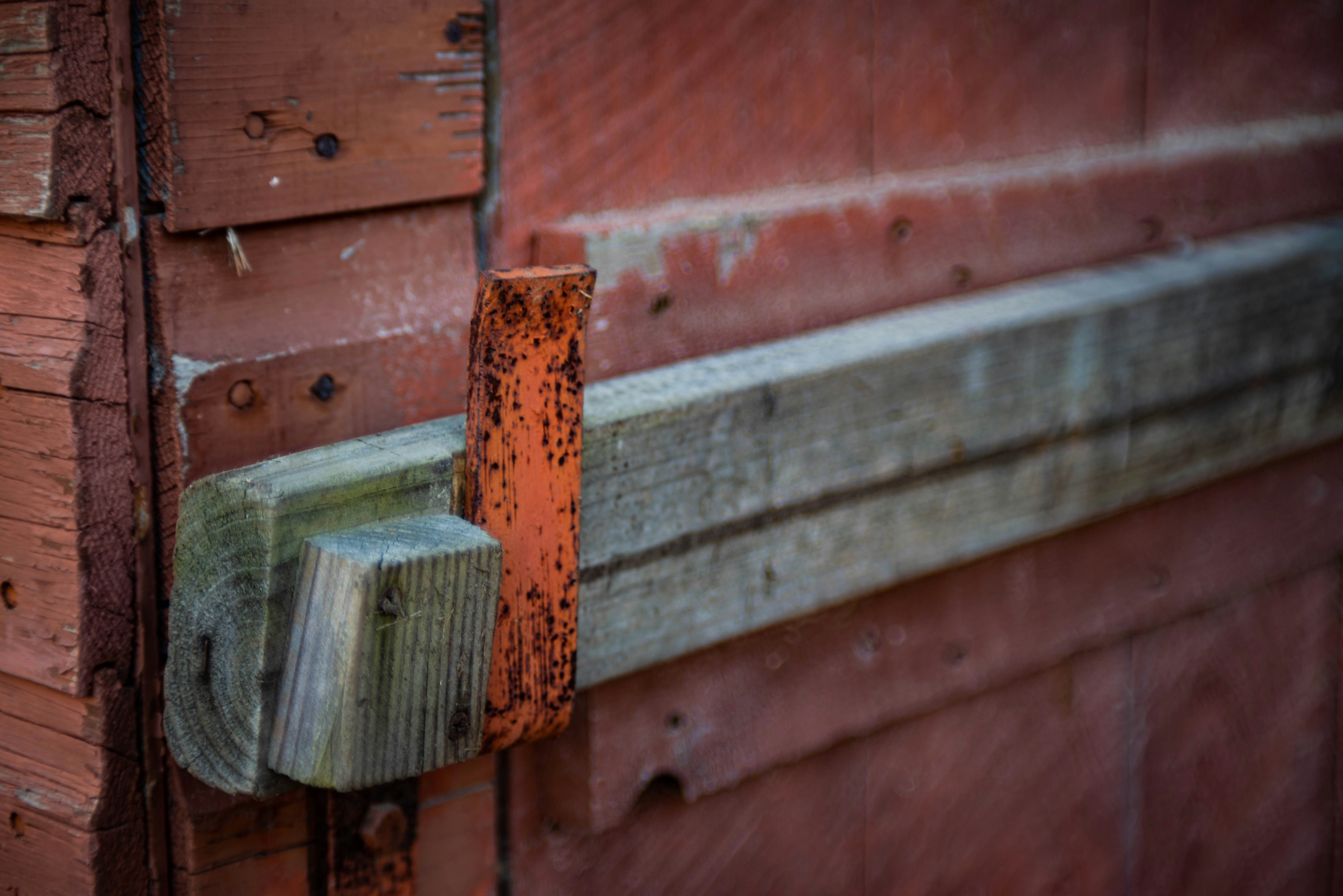 Weathered Timber and Rusted Hinge