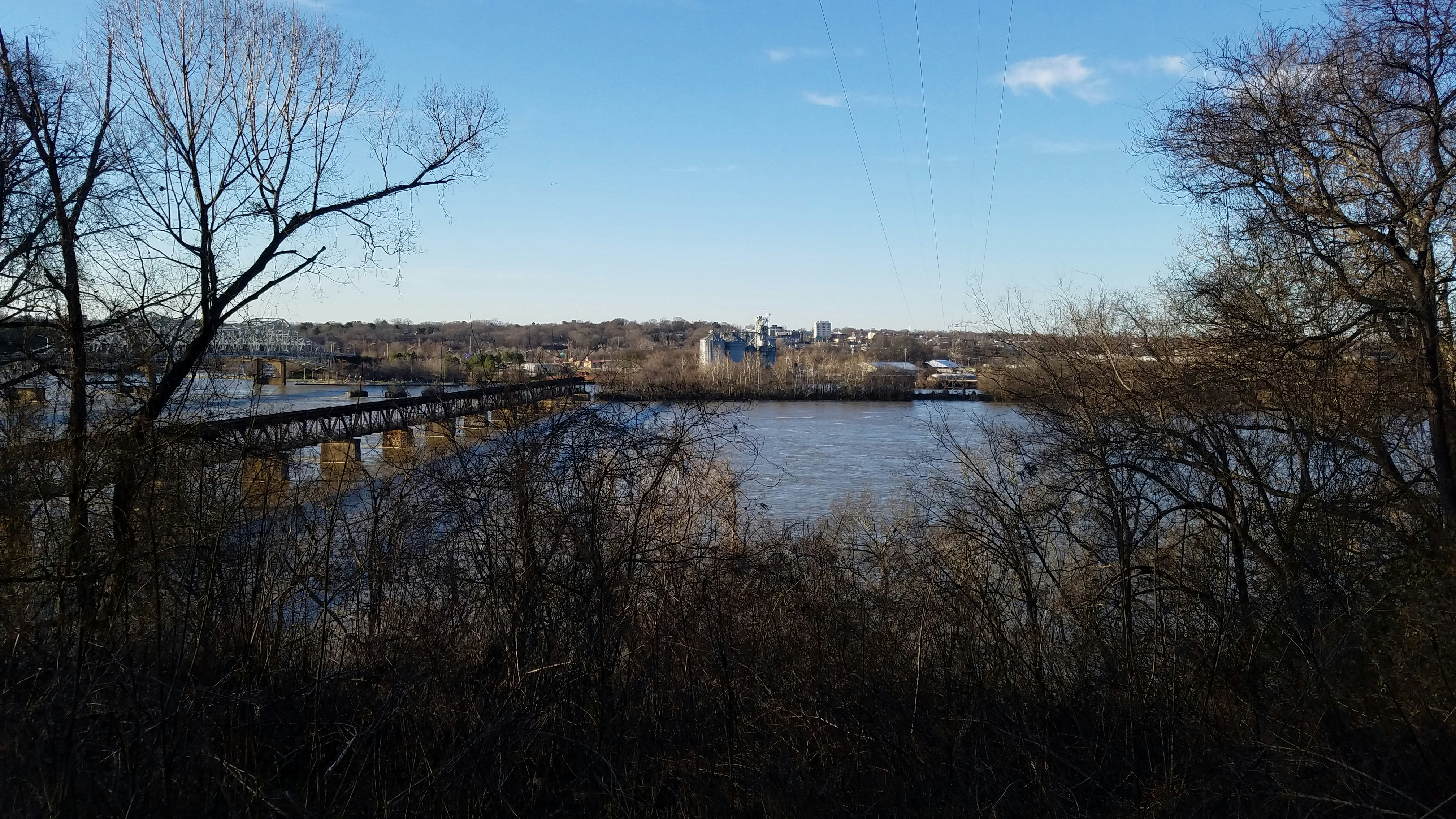 Brown wooden bridge over river under blue sky during daytime photo ...