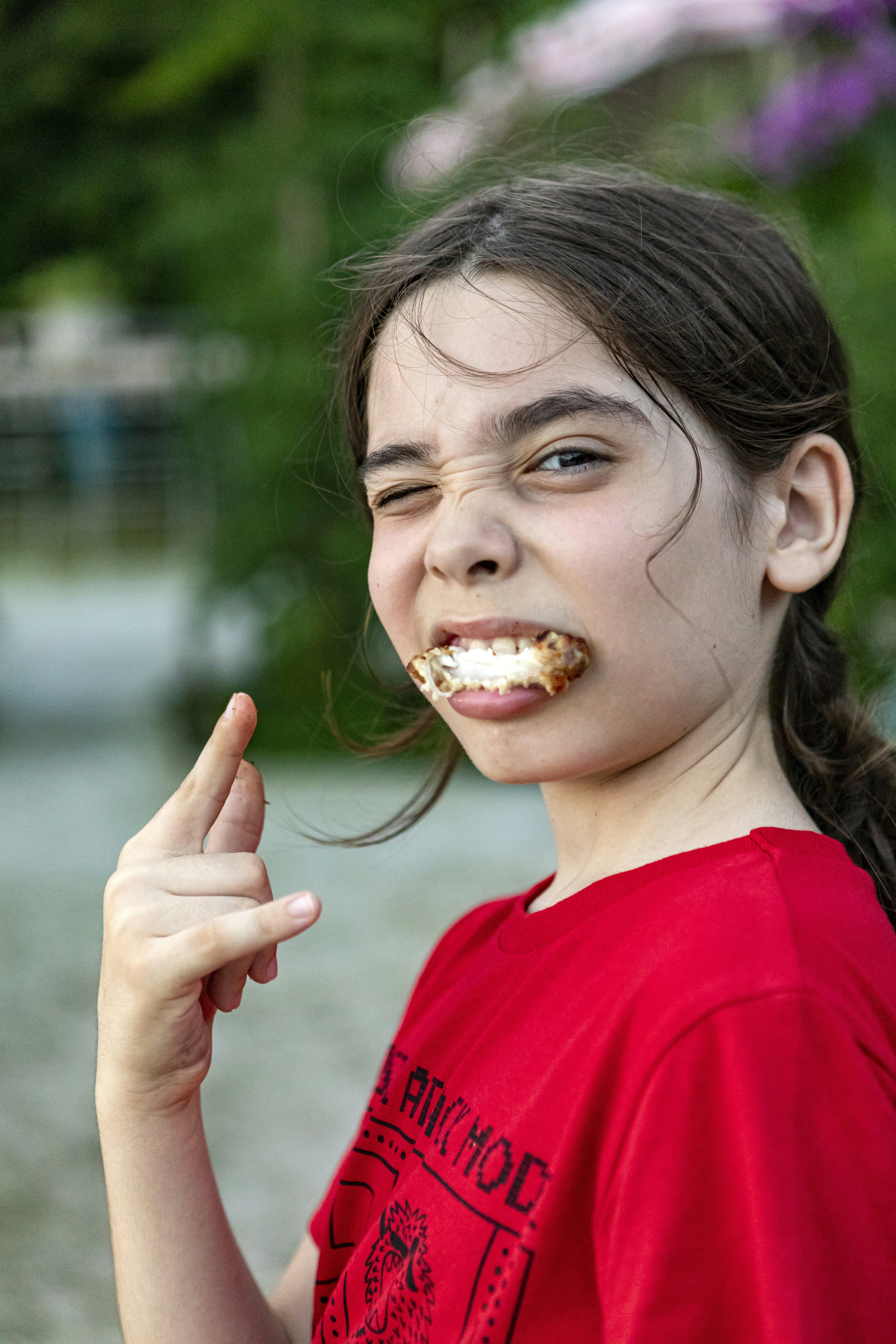 Girl in red crew neck shirt eating bread photo – Free Human Image on ...