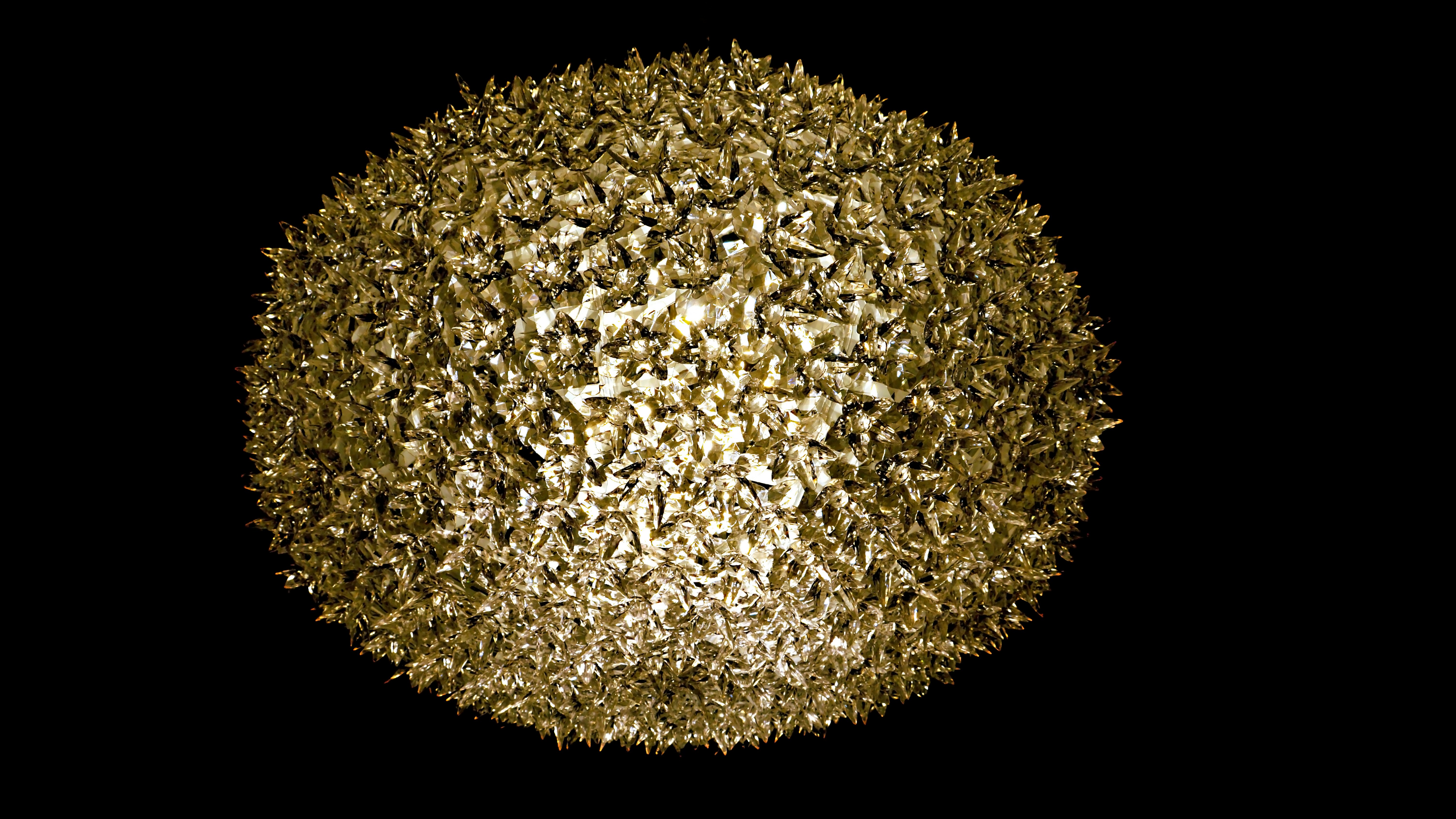Golden Spinning Globe: A Shimmering Macro of Textured Metal