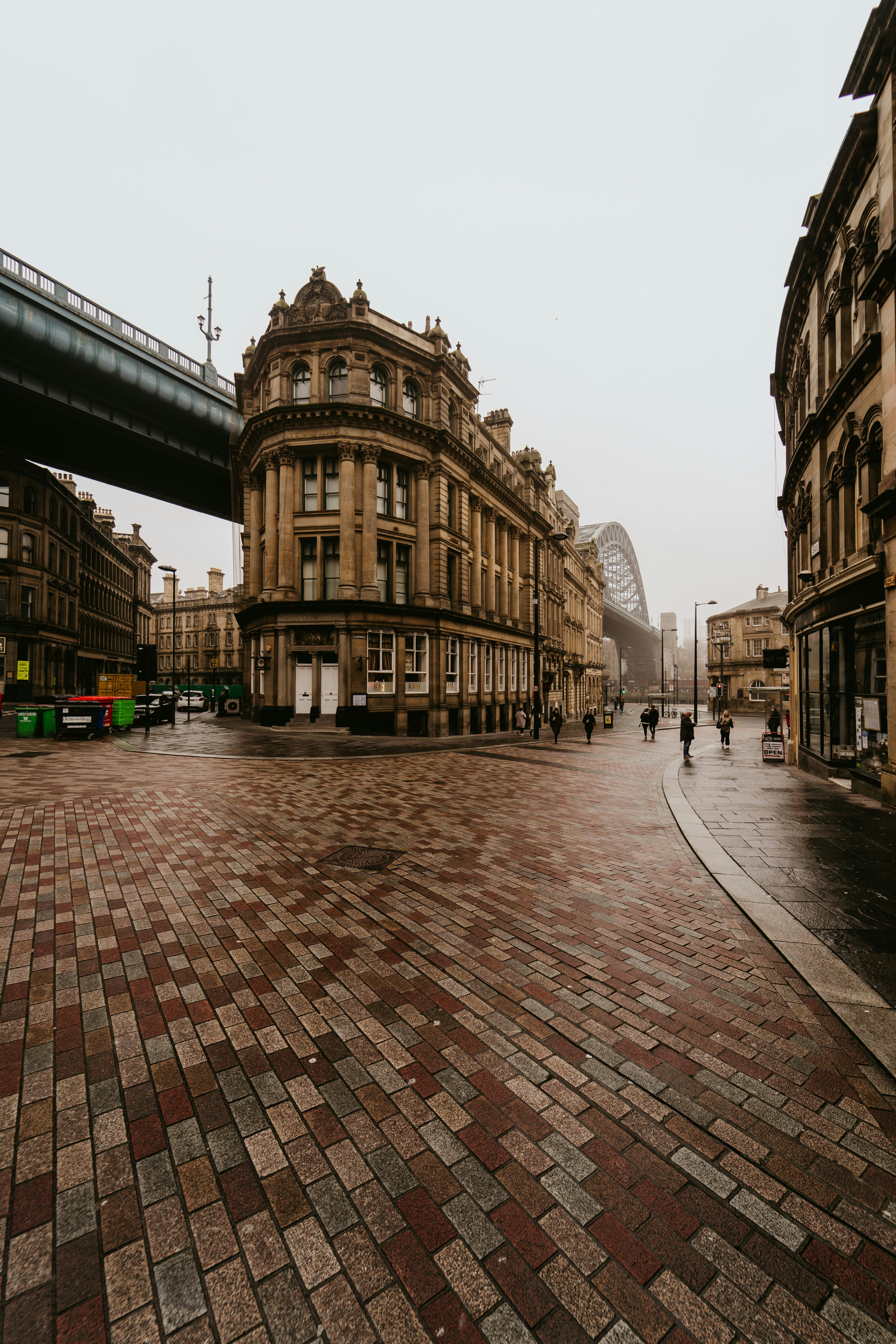 Urban Rain over York Terrace: Facades, Bridge, and Wet Cobbles