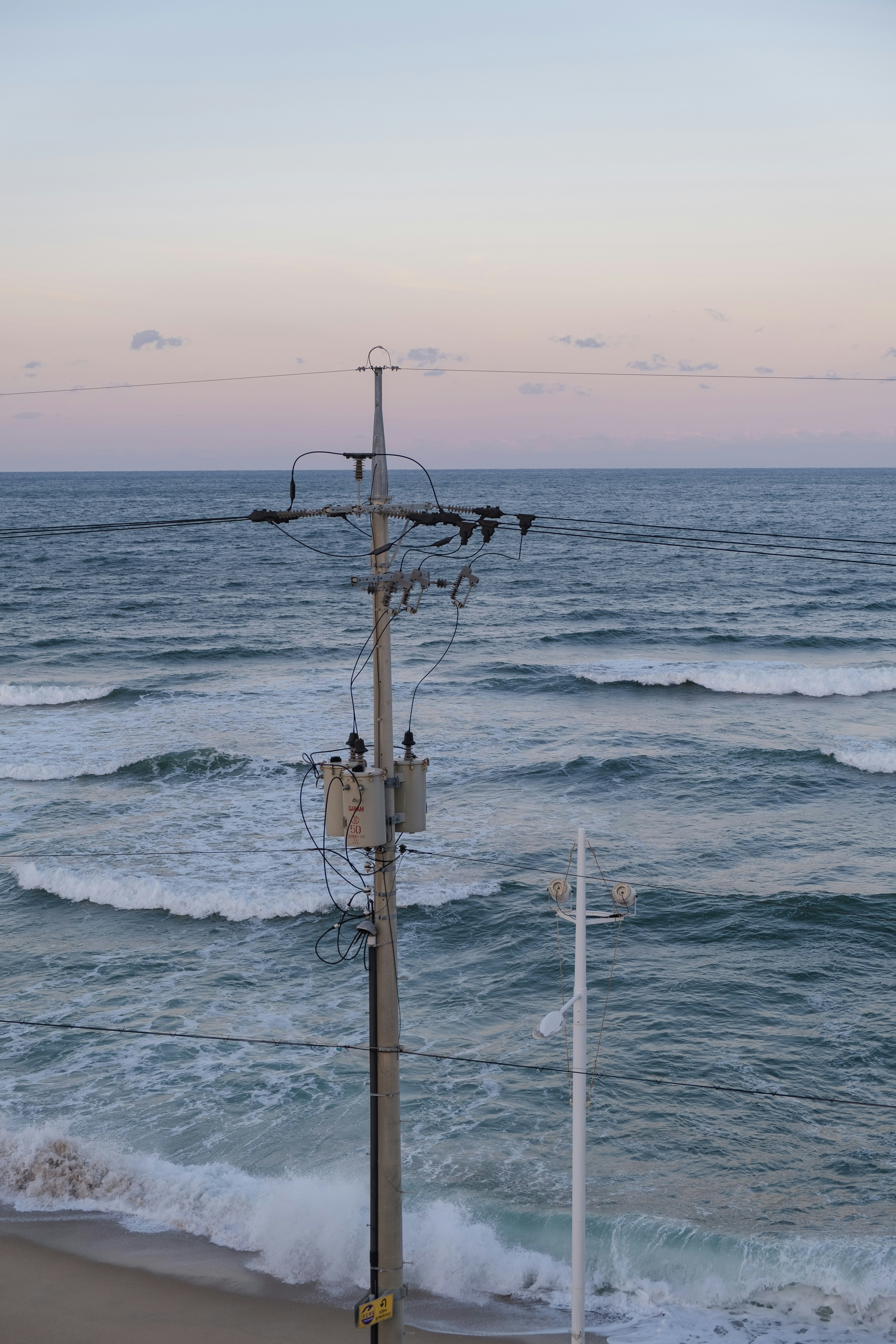 Coastal Power Lines Weaving Through Sea Breeze