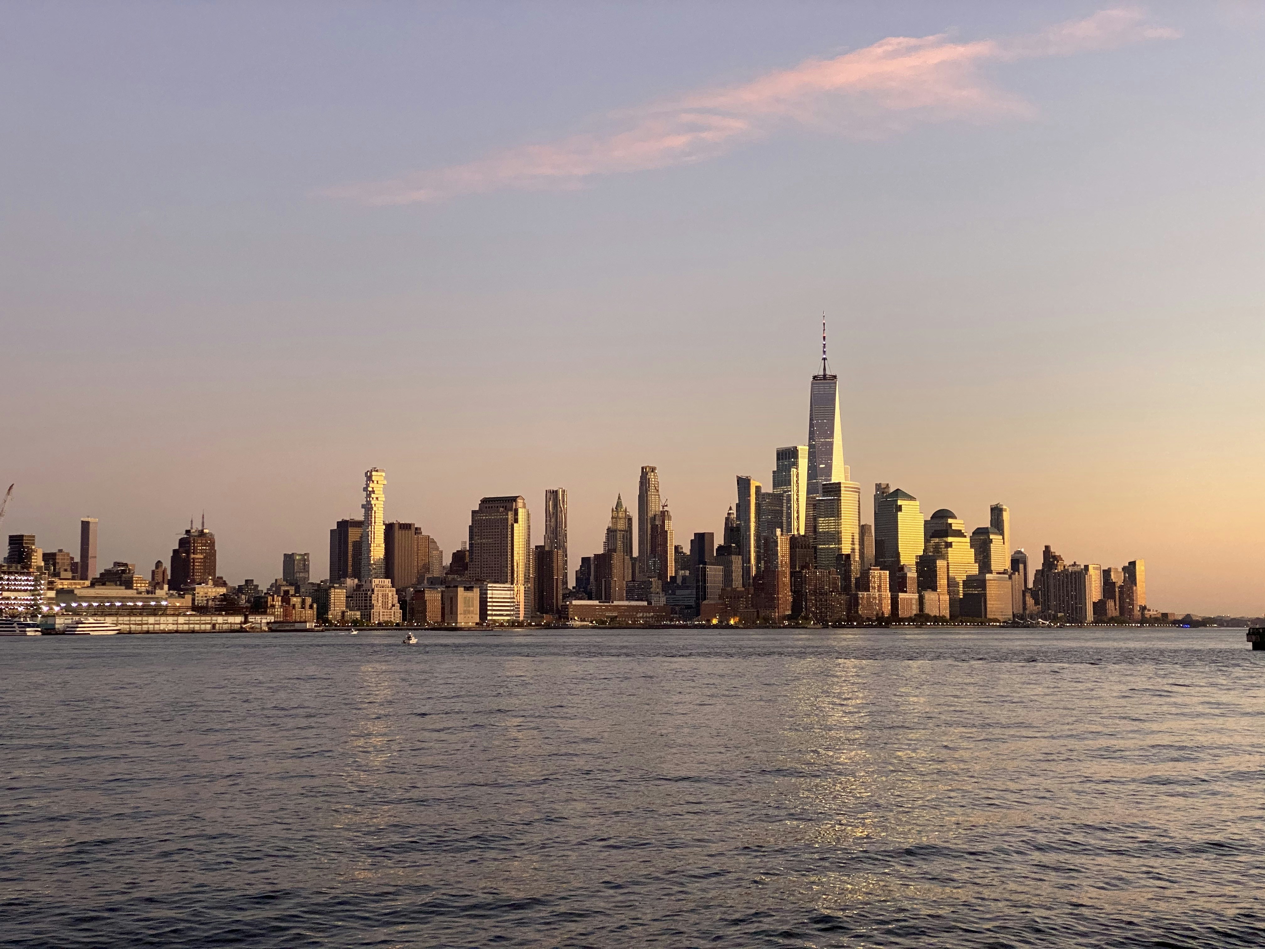 Sunset from Hoboken, NJ with view of NYC Financial District skyline | city skyline during day time