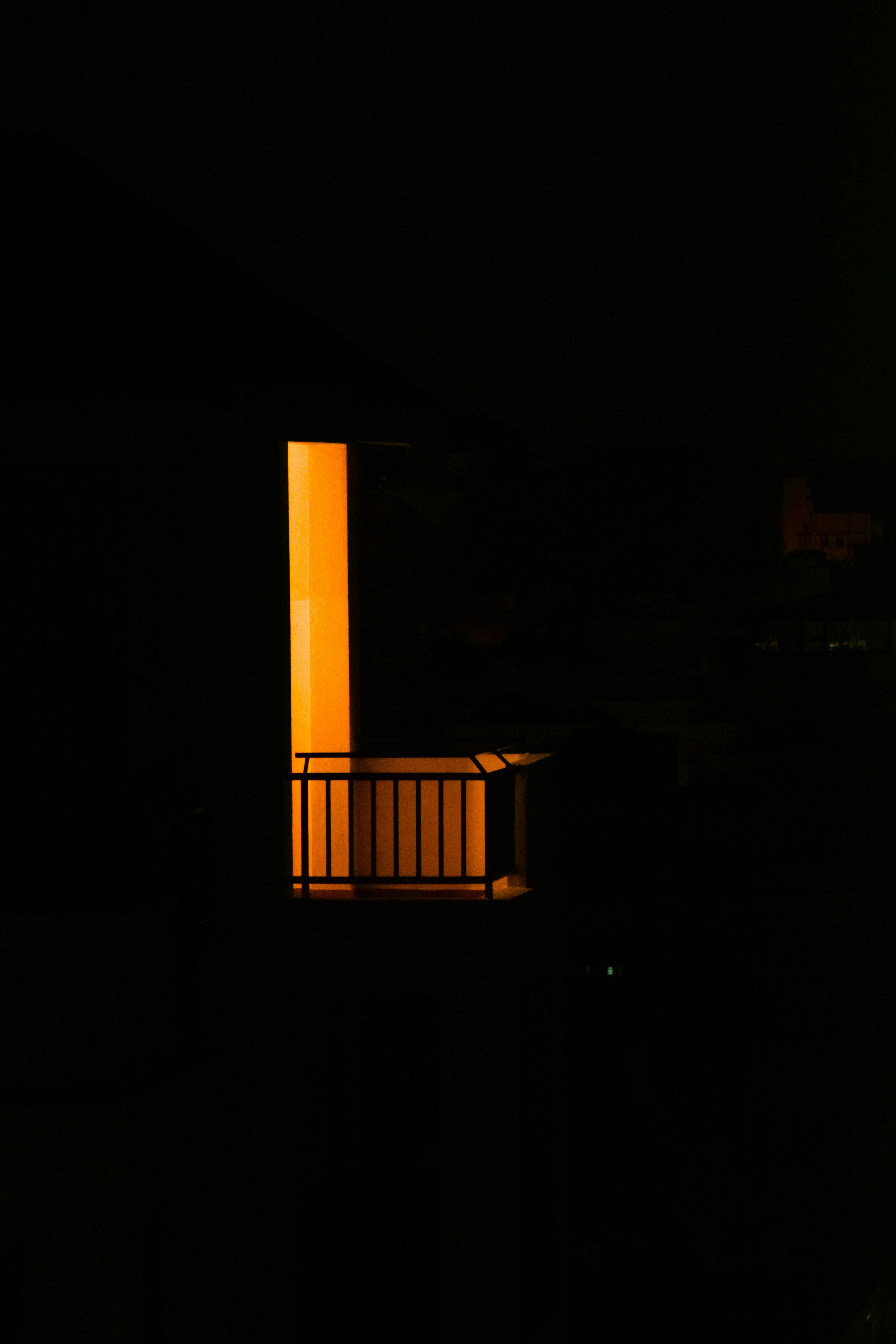Orange tower in dark room photo – Free Banister Image on Unsplash
