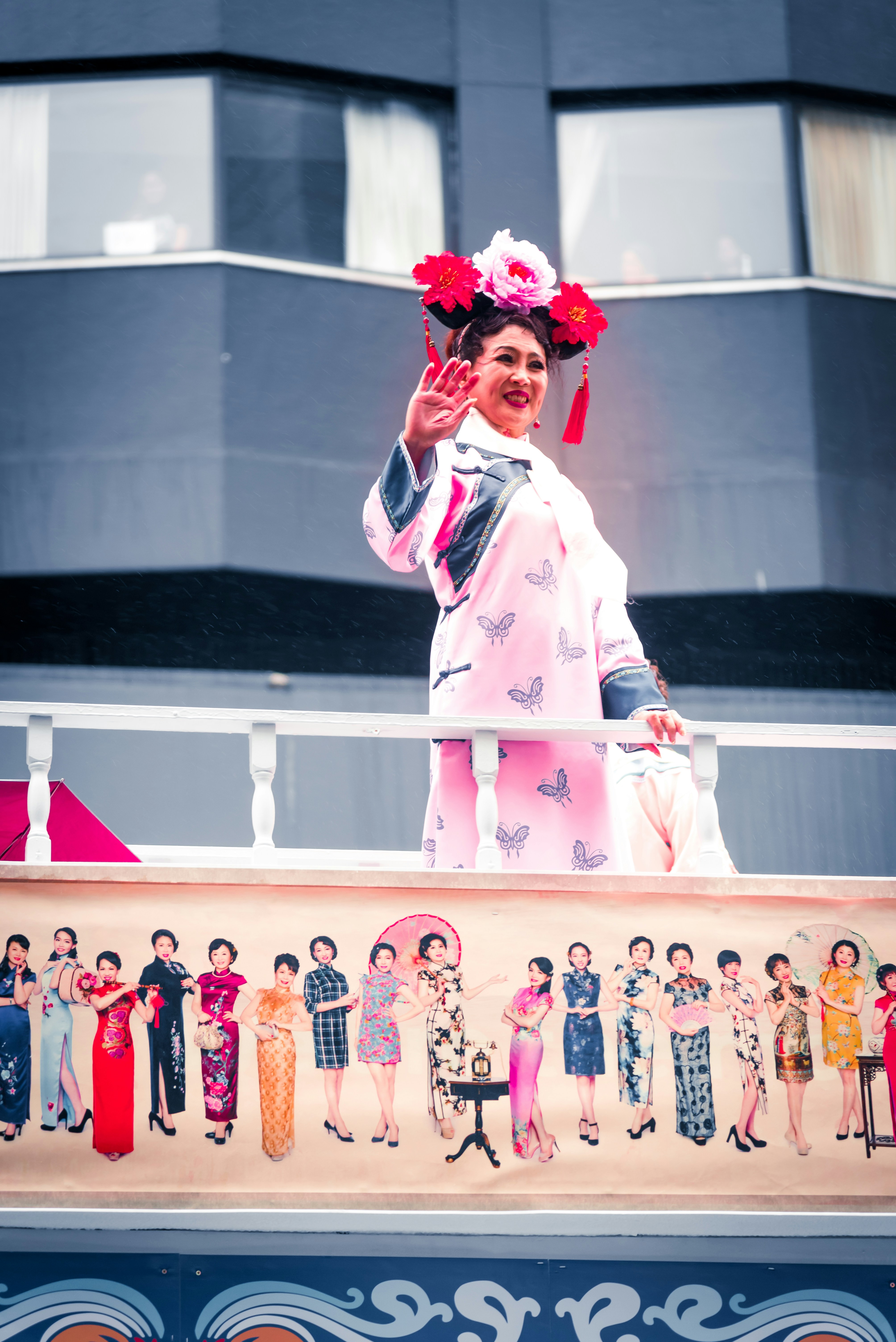 Graceful Performer on Balcony, Traditional Attire with Floral Headdress