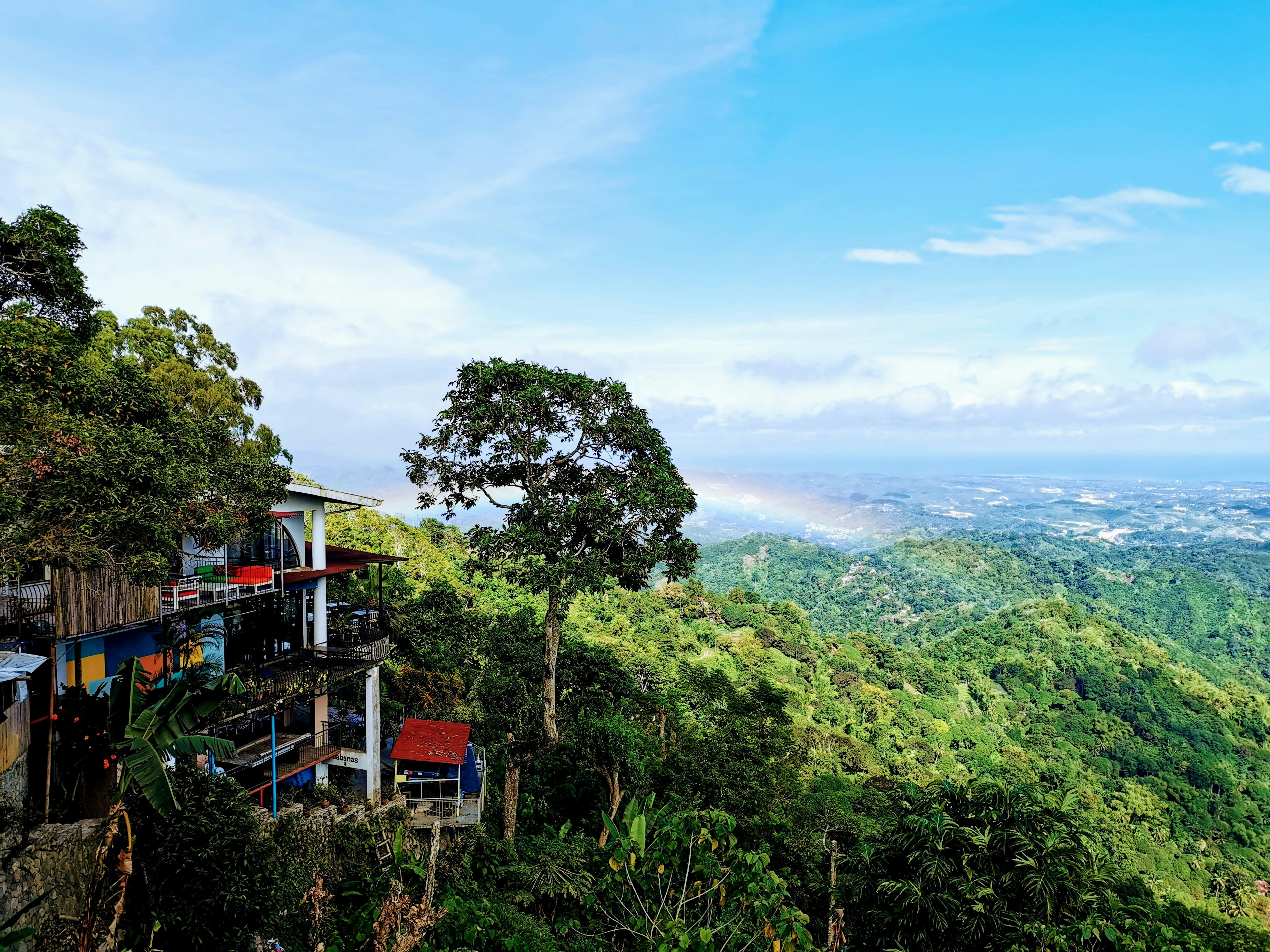 Clifftop Retreat: A Terrace Overlooking a rolling Green Landscape