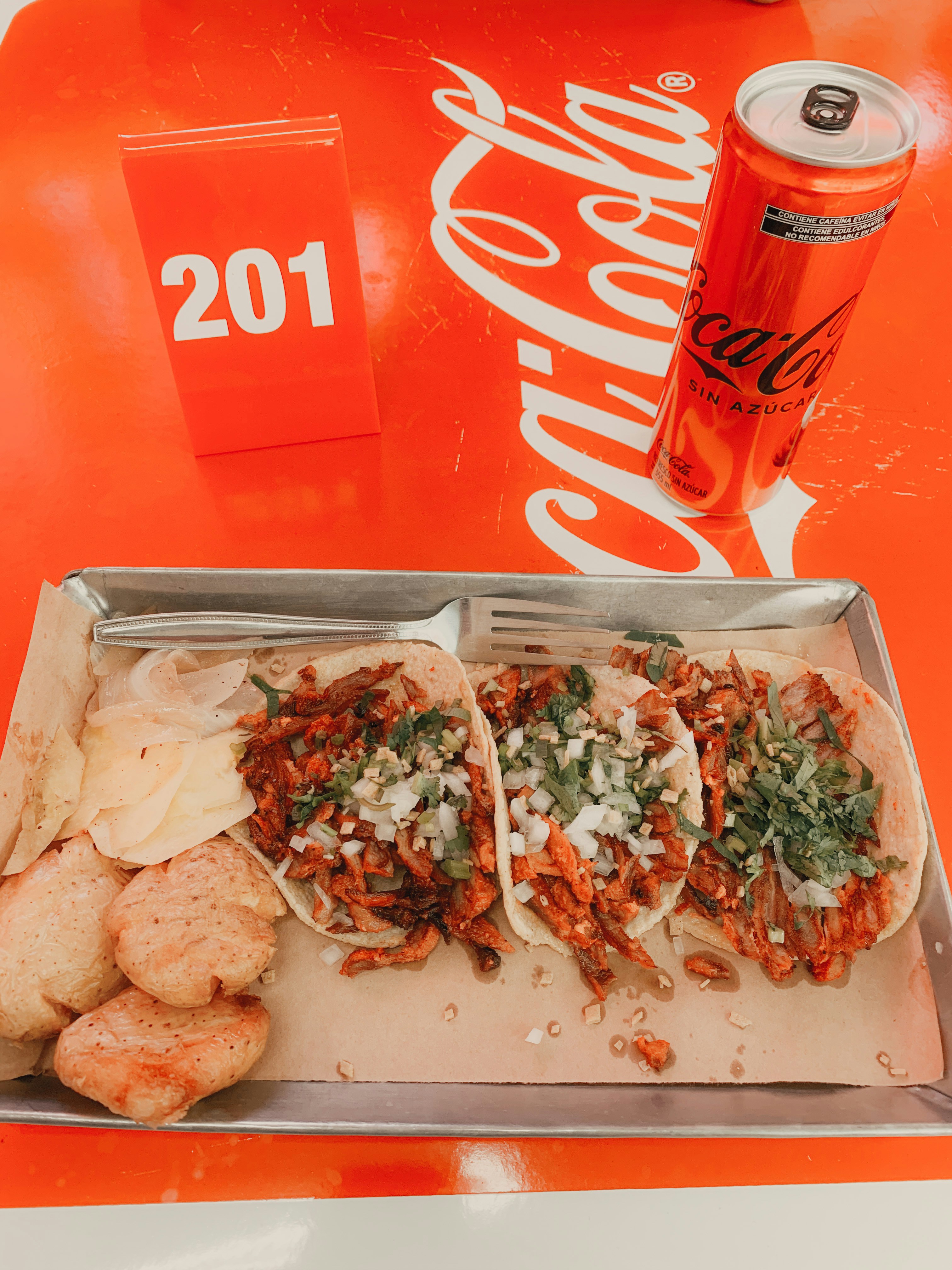 Crispy Taco Trio on a Coca-Cola Red Counter