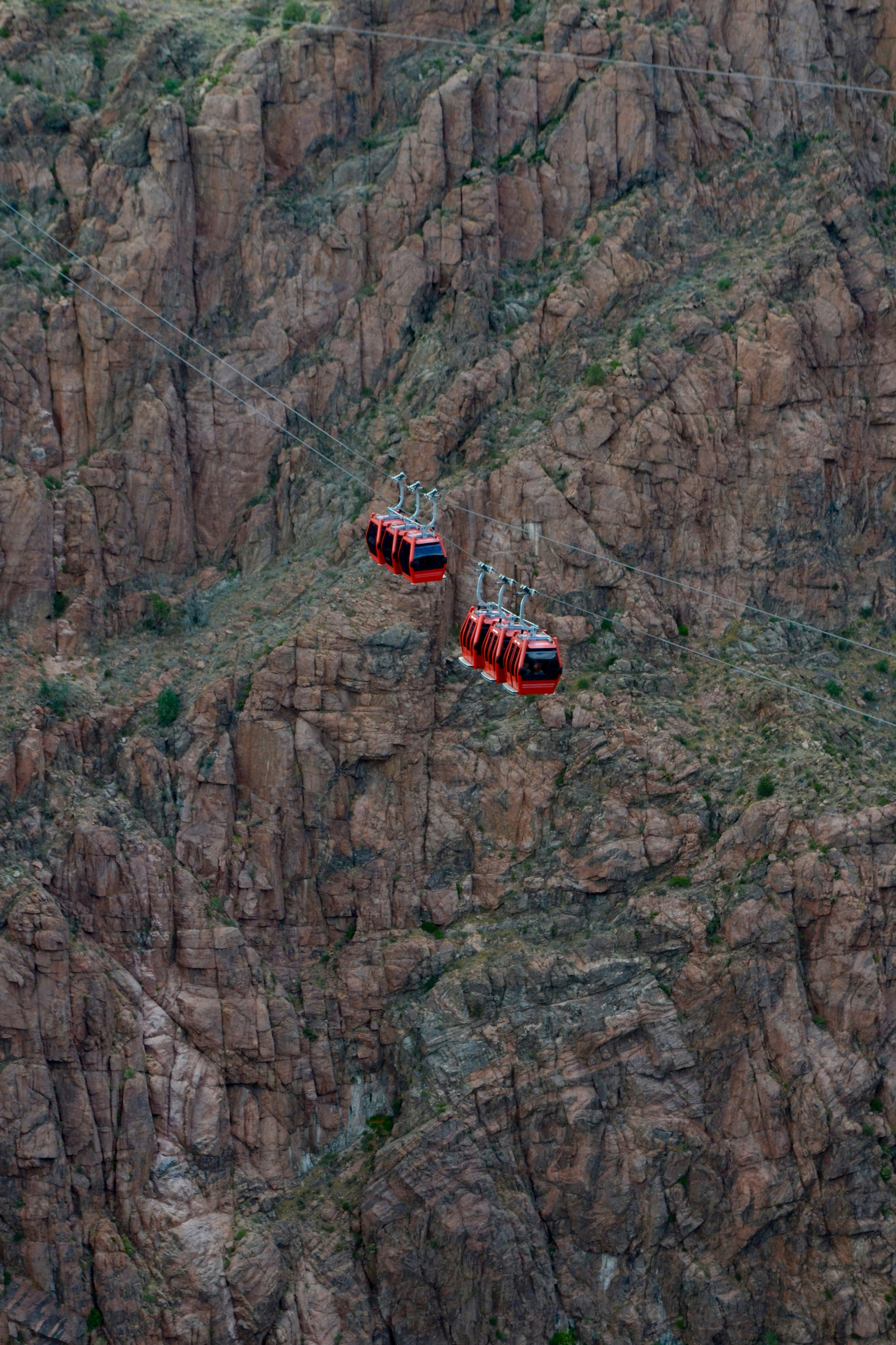 Red Gondolas Thread the Granite Ravine