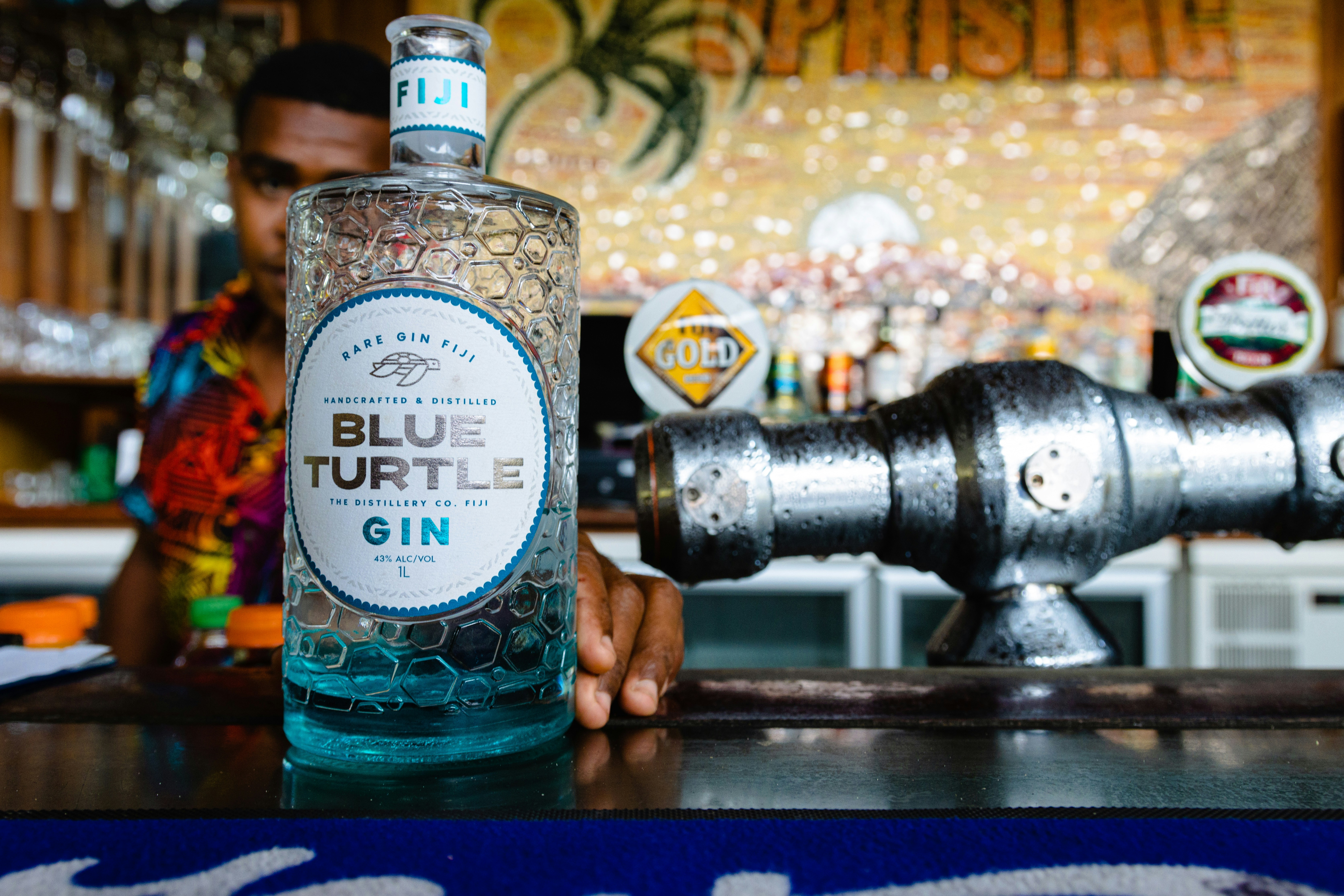 Blue Turtle Gin on a Busy Bar Shelf