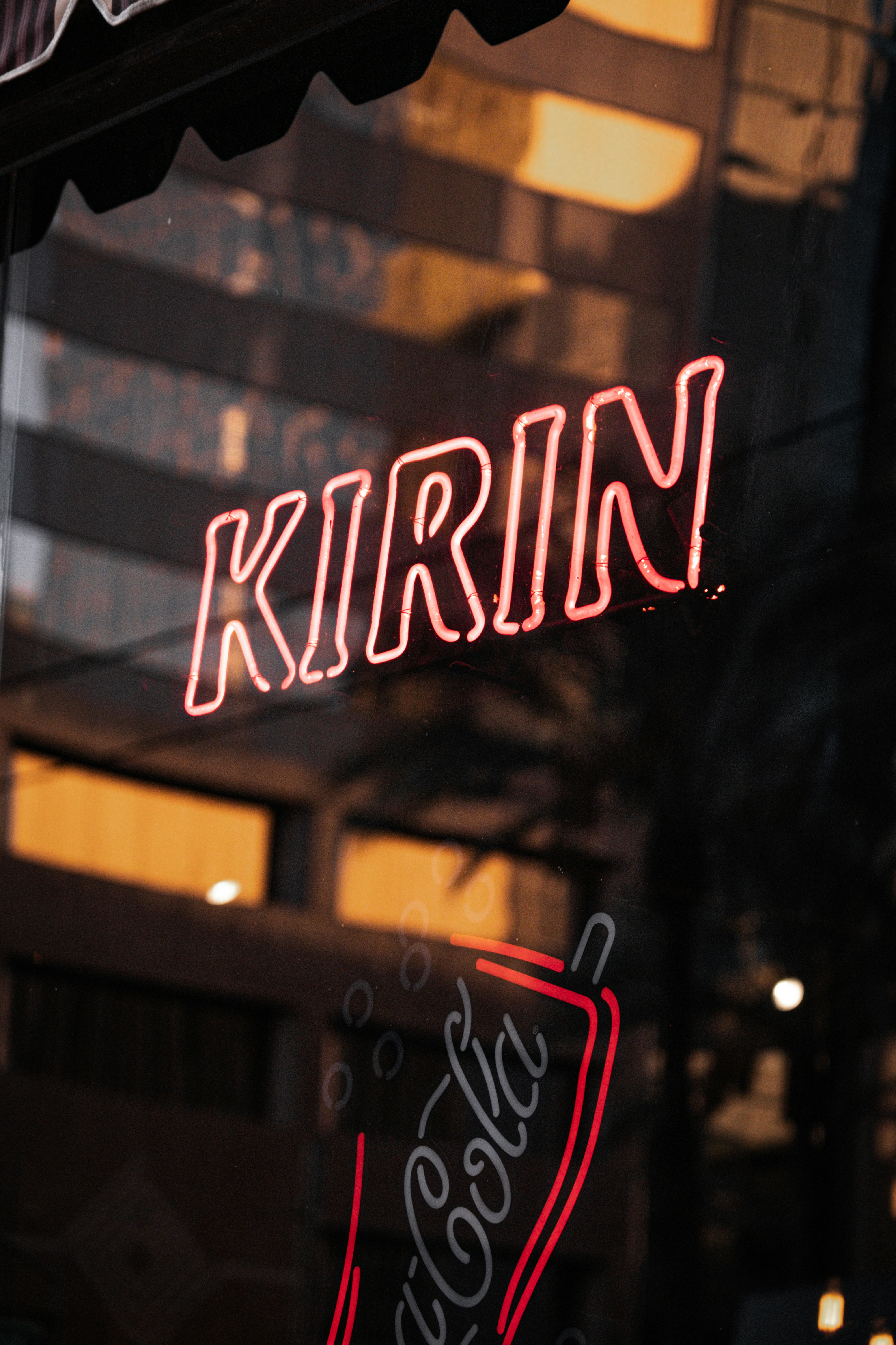 KIRIN Neon in the Glass: Reflections and Quiet Urban Glow
