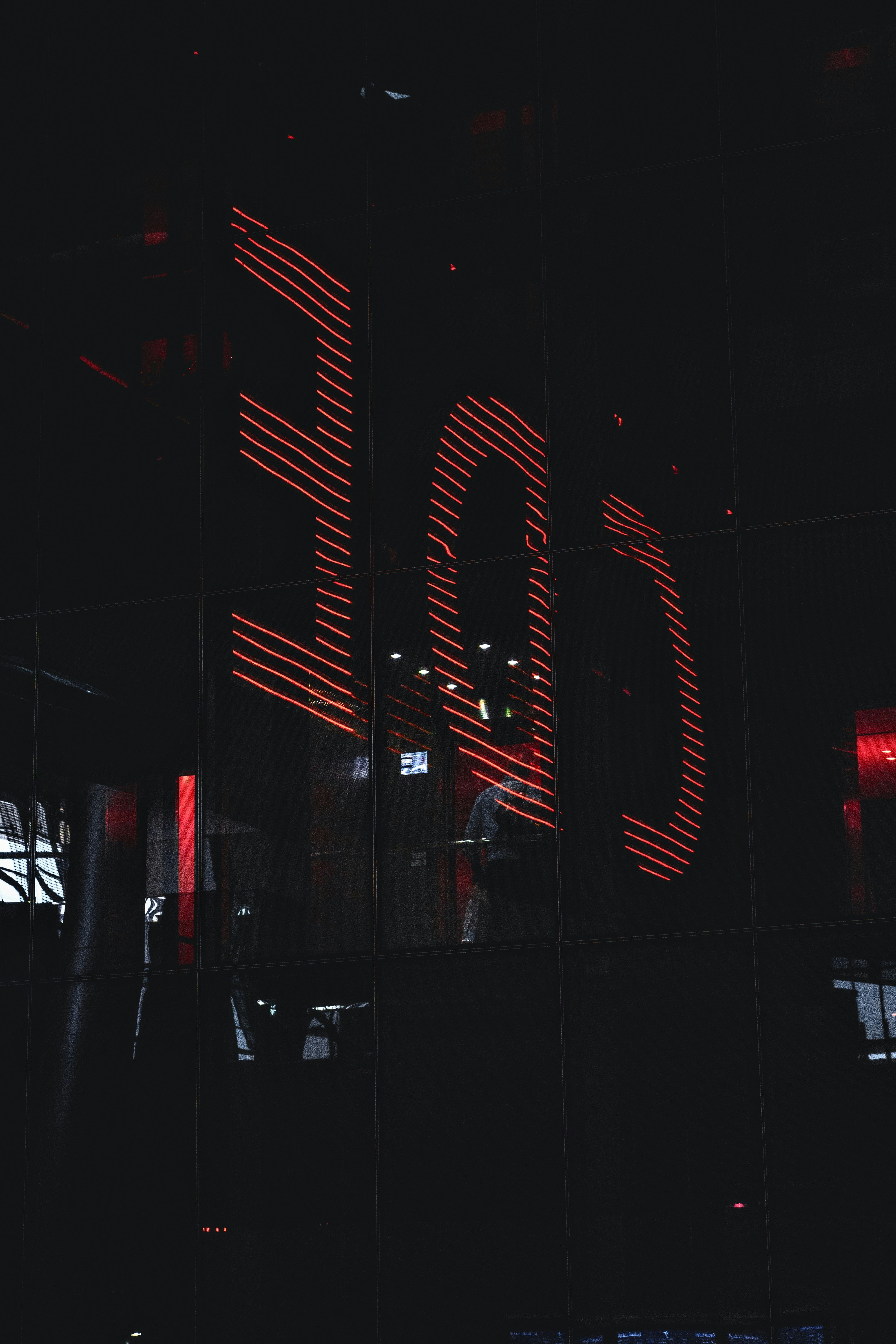 Neon Red Pulse on a Dark Facade
