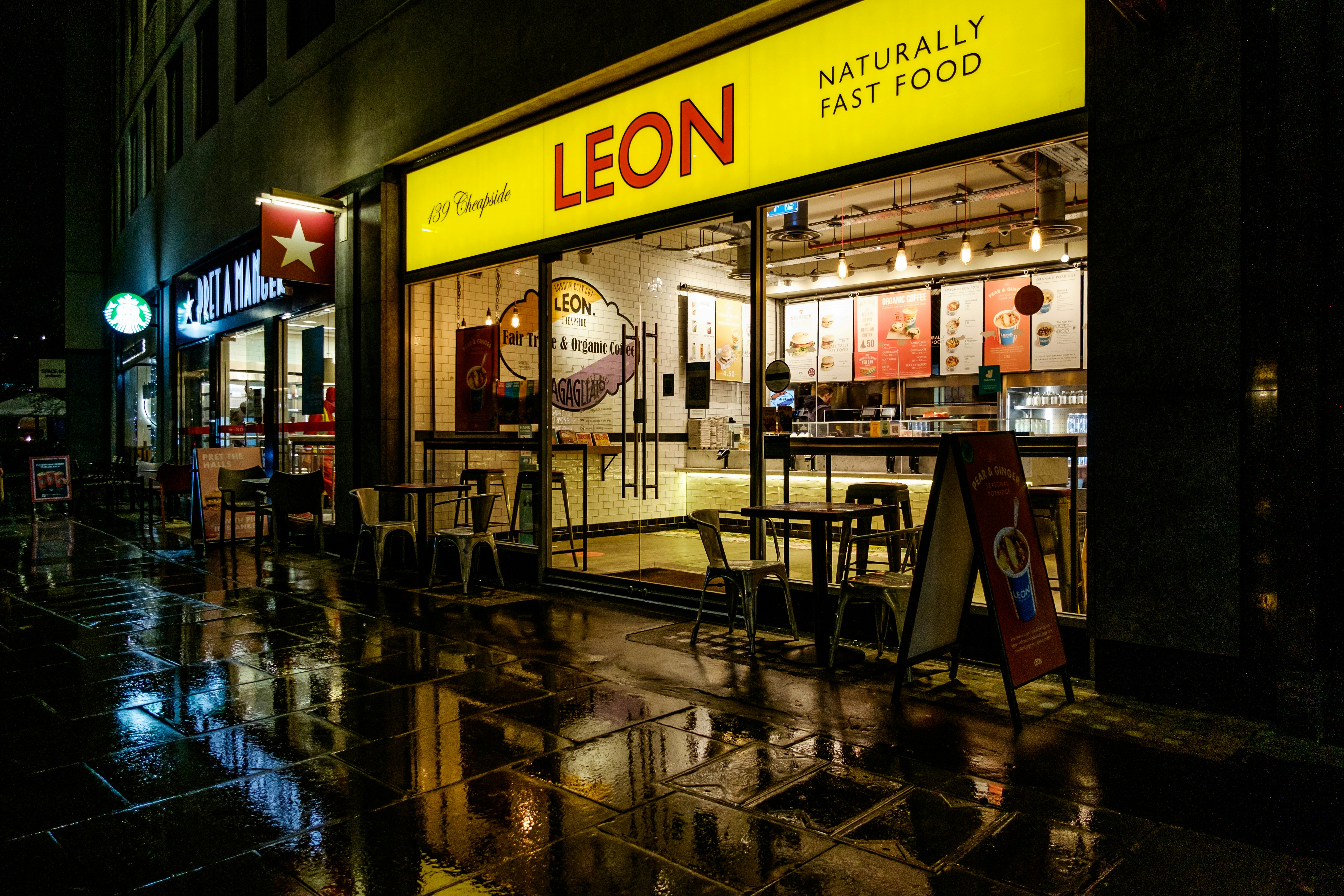 Brown wooden chairs and tables in restaurant photo – Free Cheapside ...