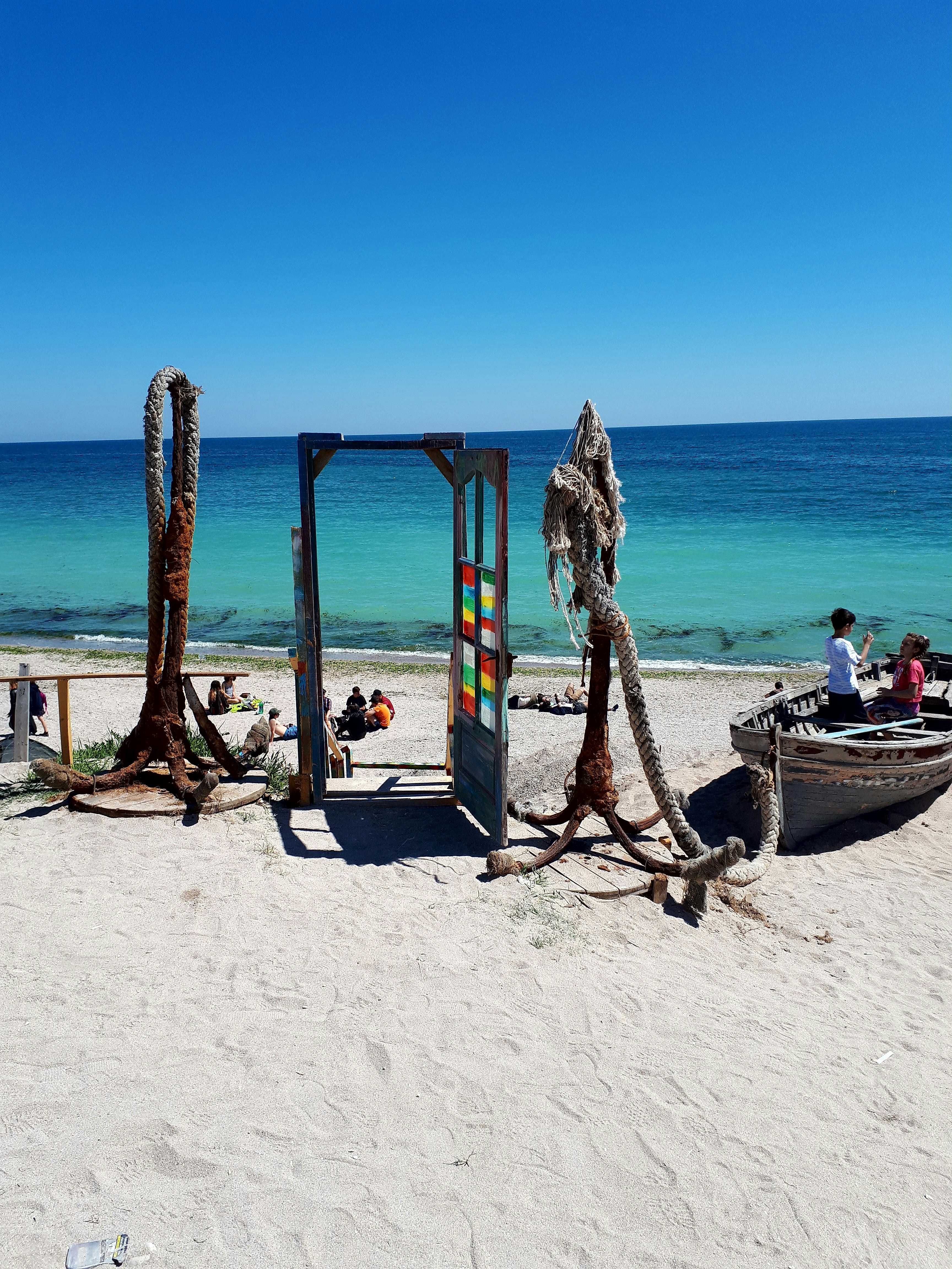 The Sea Gate: A Weathered Doorway Framing Turquoise Waters