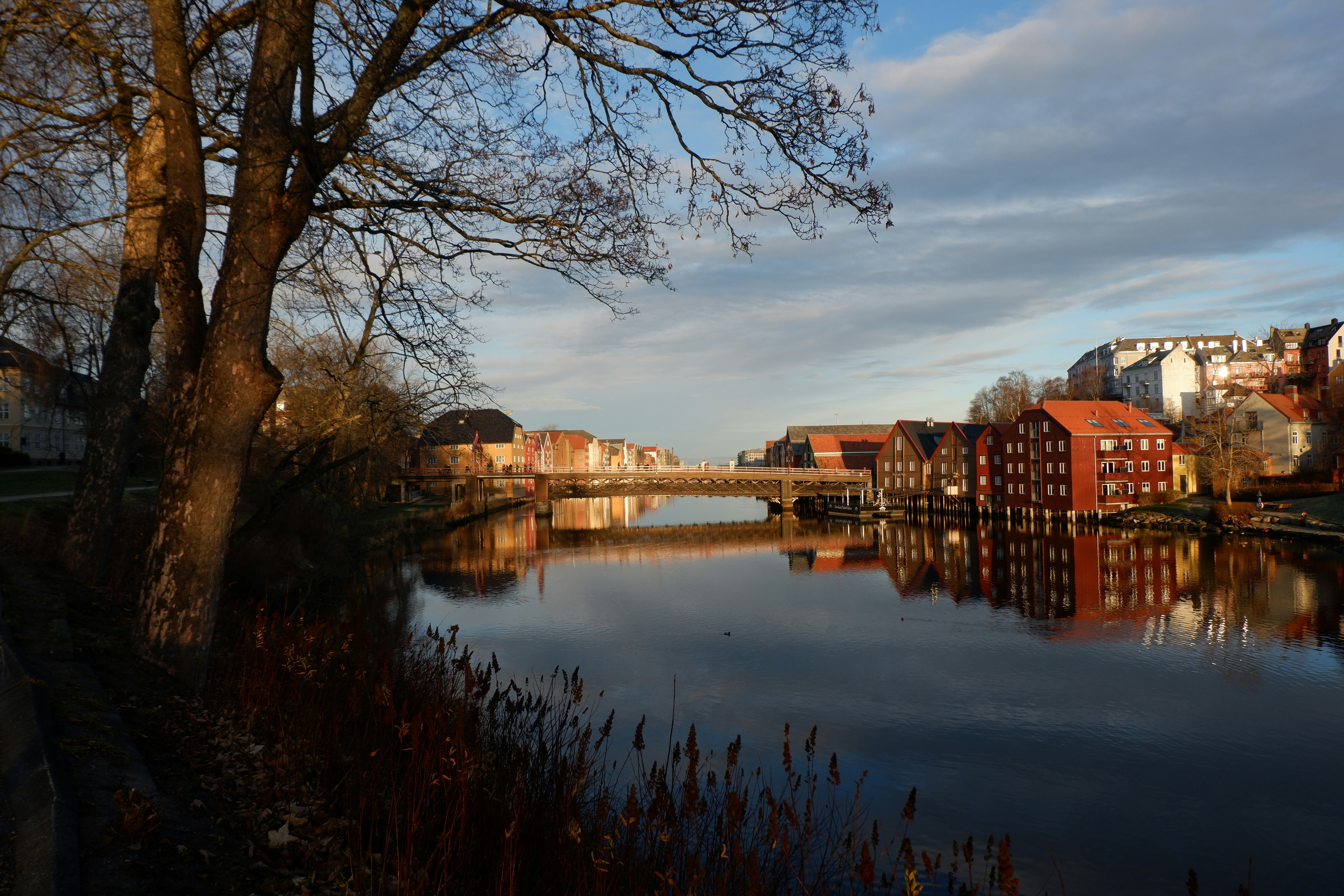 body of water near brown building during daytime