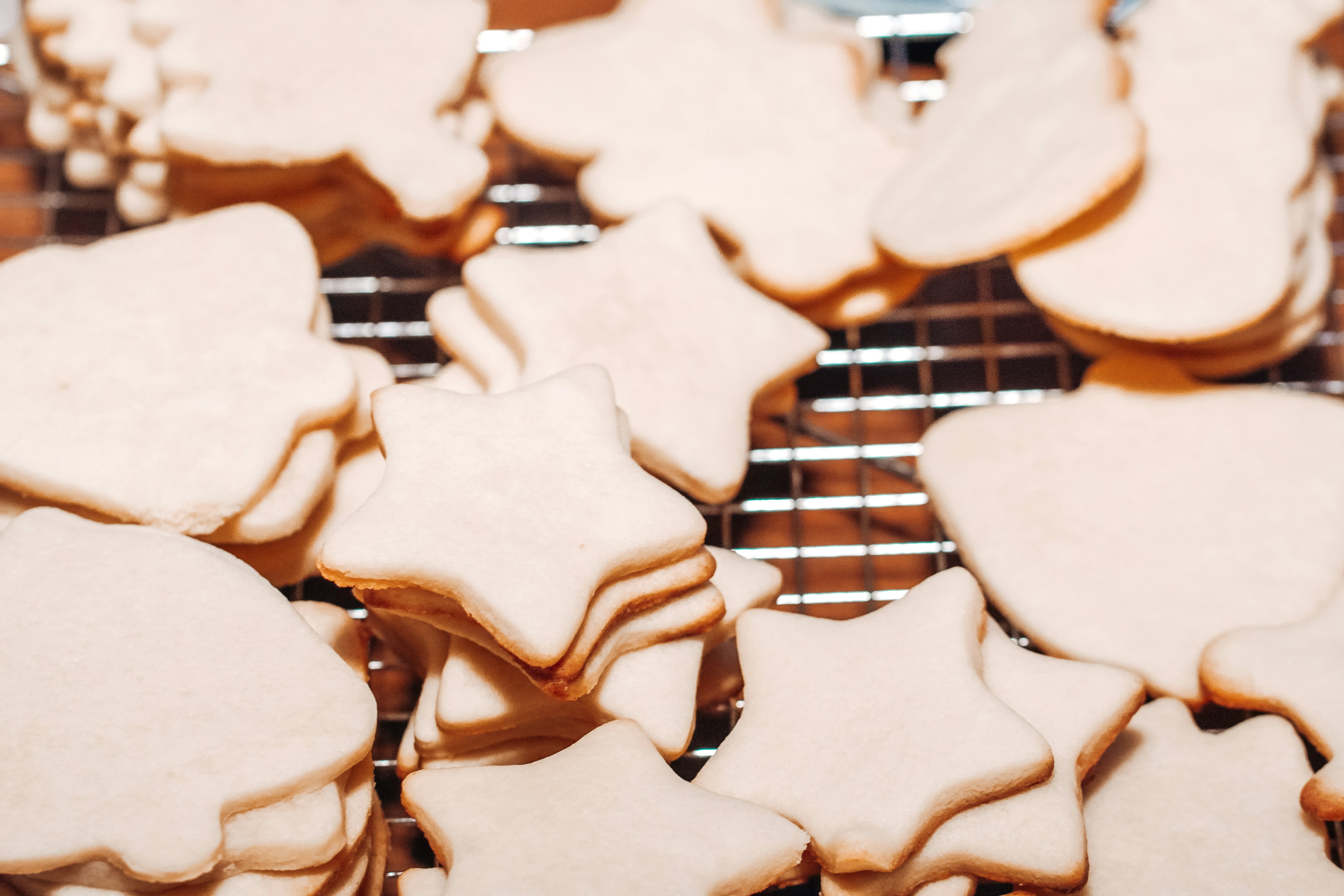 Golden Star Cookies Cooling on a Gleaming Wire Rack