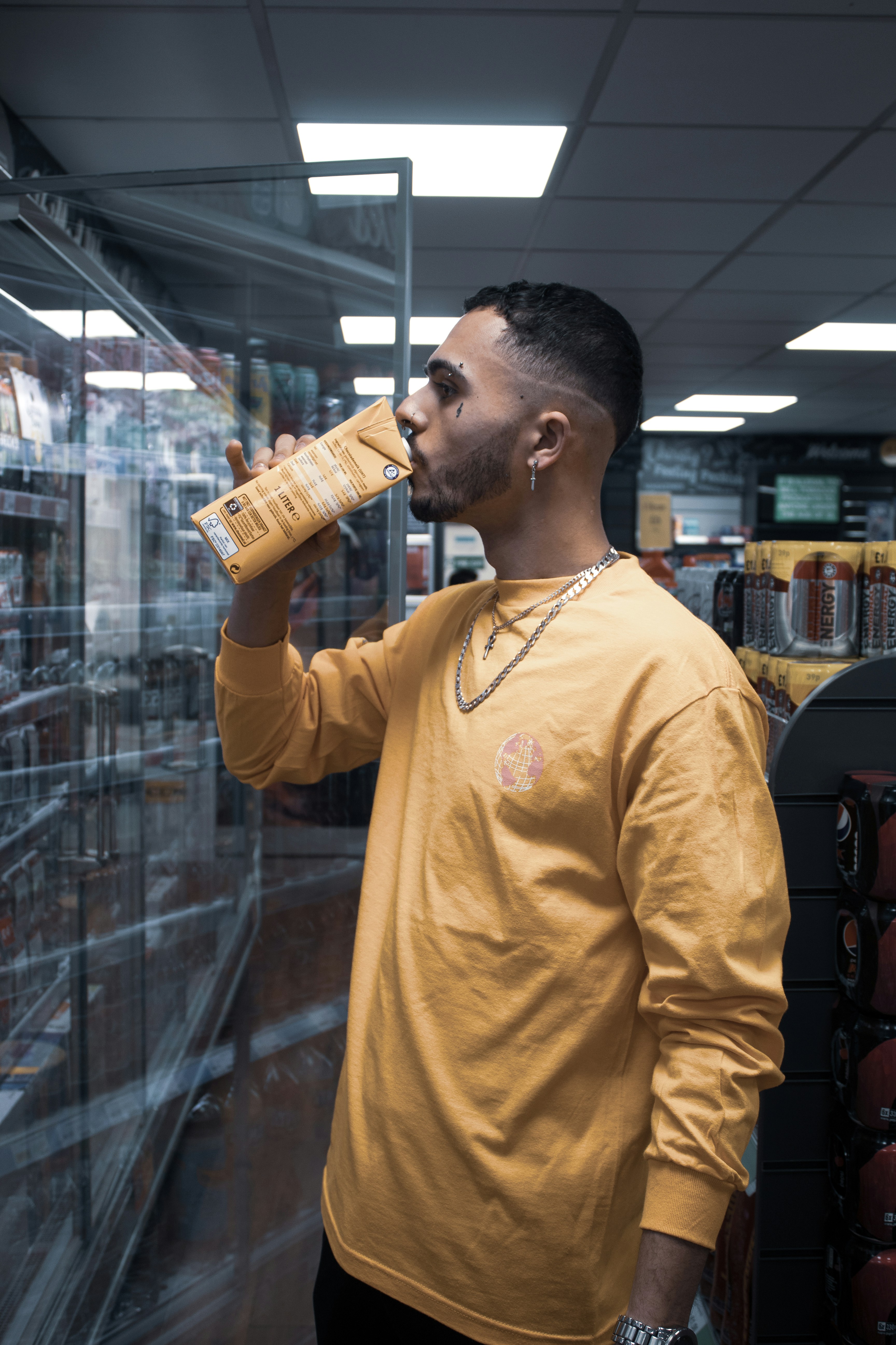 Aisle Sip: Mustard Hoodie Moment in a Grocery-Store Framed Light